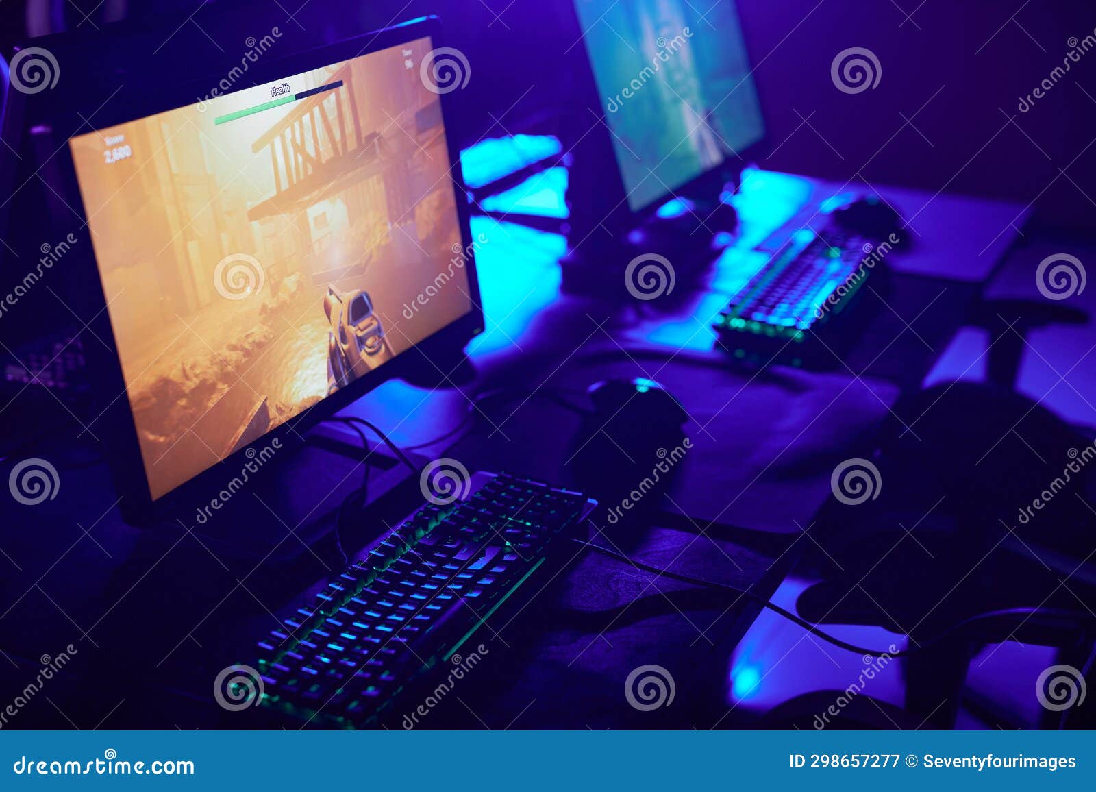 Gaming Setup with Neon Lights and Video Game on Computer Screen Stock ...