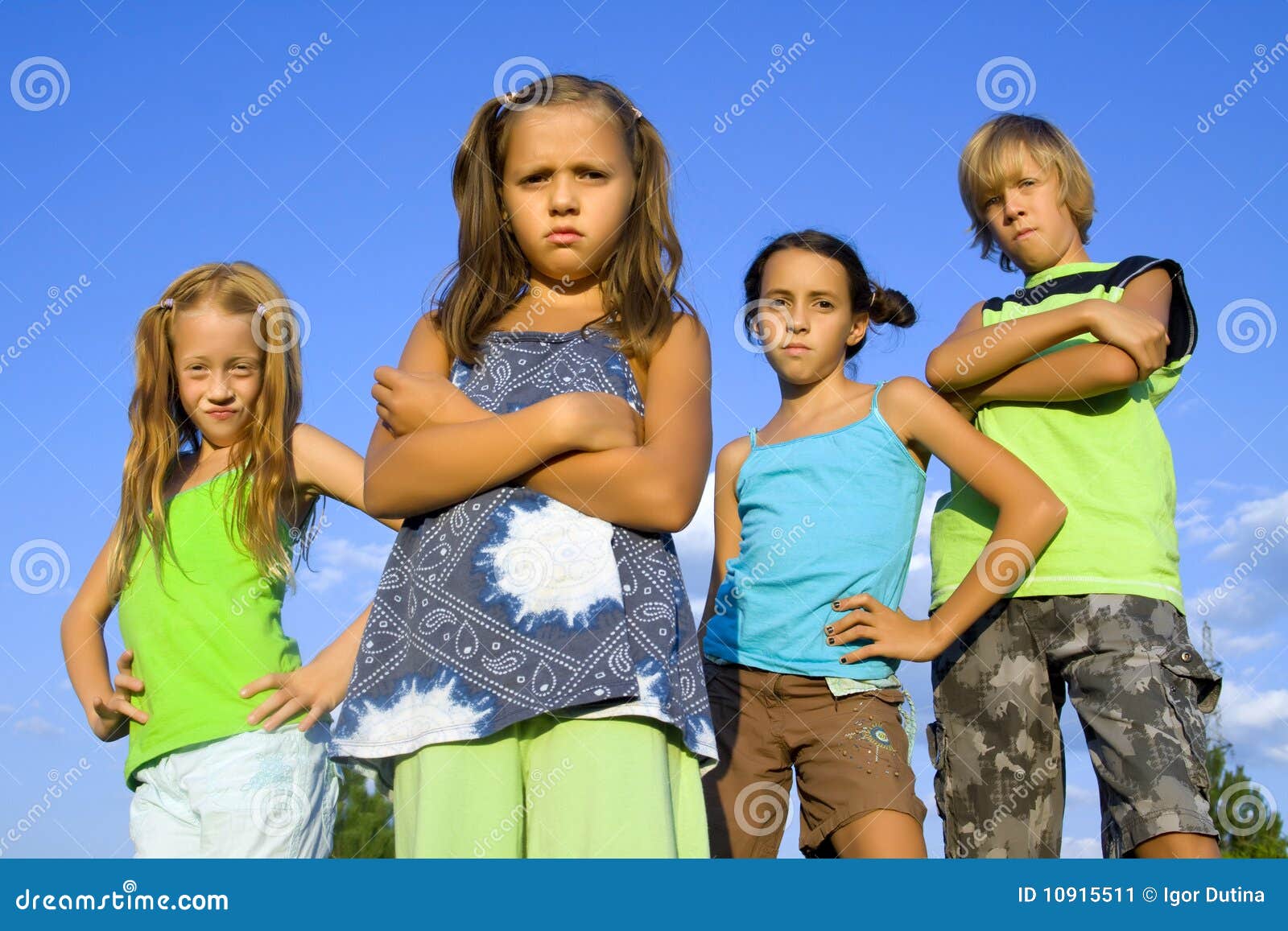 Four Kids Sitting In Row With Hands Up Royalty-Free Stock Photo ...