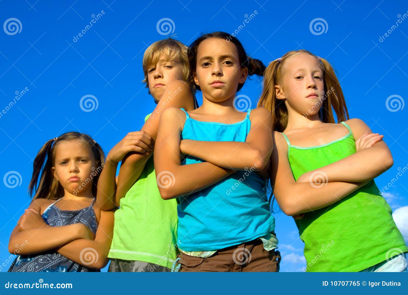 Gang of four serious kids stock image. Image of group - 10707765