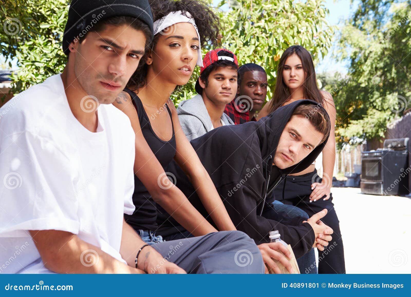 Gang of Young People in Urban Setting Sitting on Bench Stock Image ...