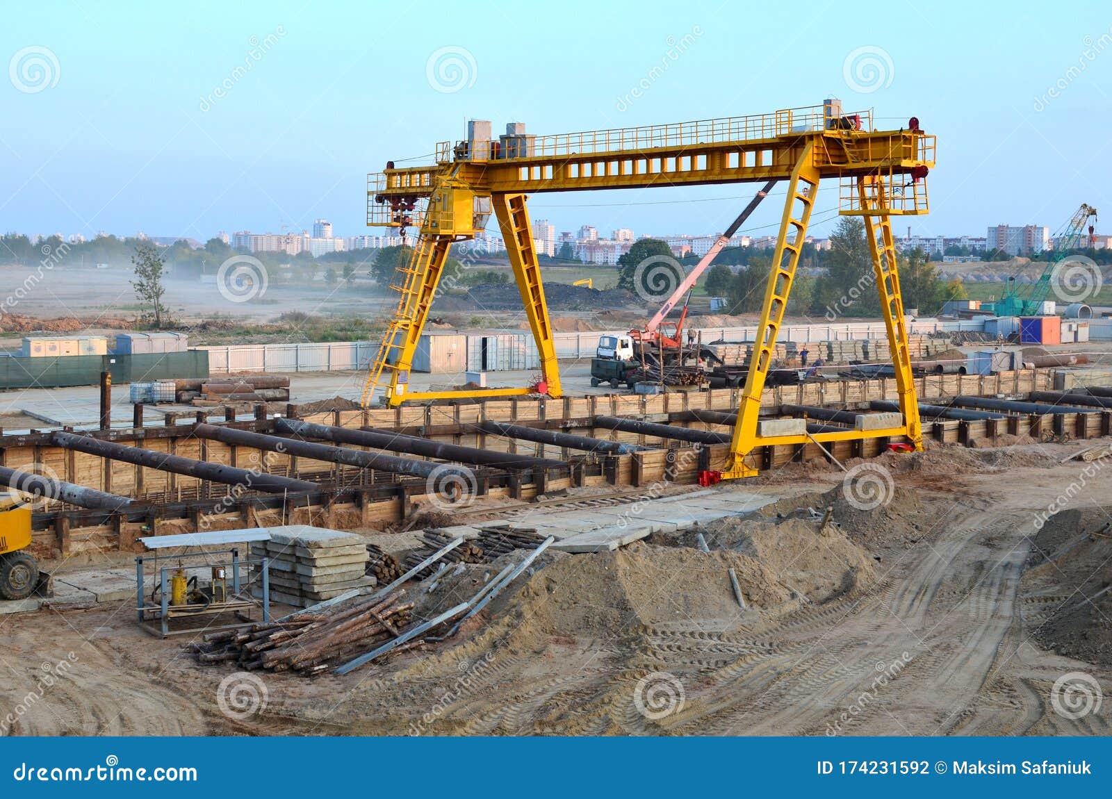 Gantry Crane and Auto Crane Working at Construction Site. Digging a Pit ...
