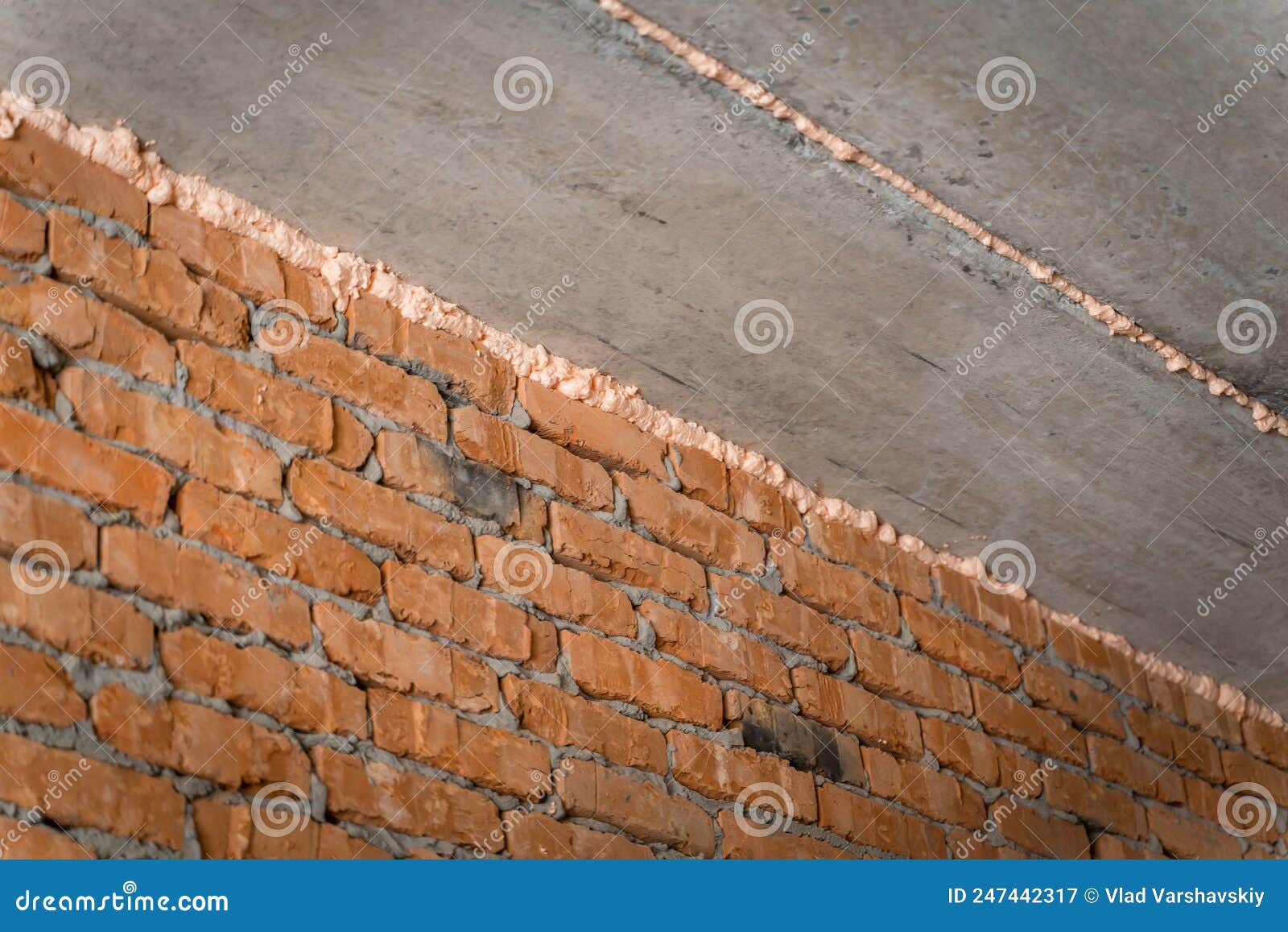 The Gap between the Concrete Floor Panels and the Brick Wall is Filled ...