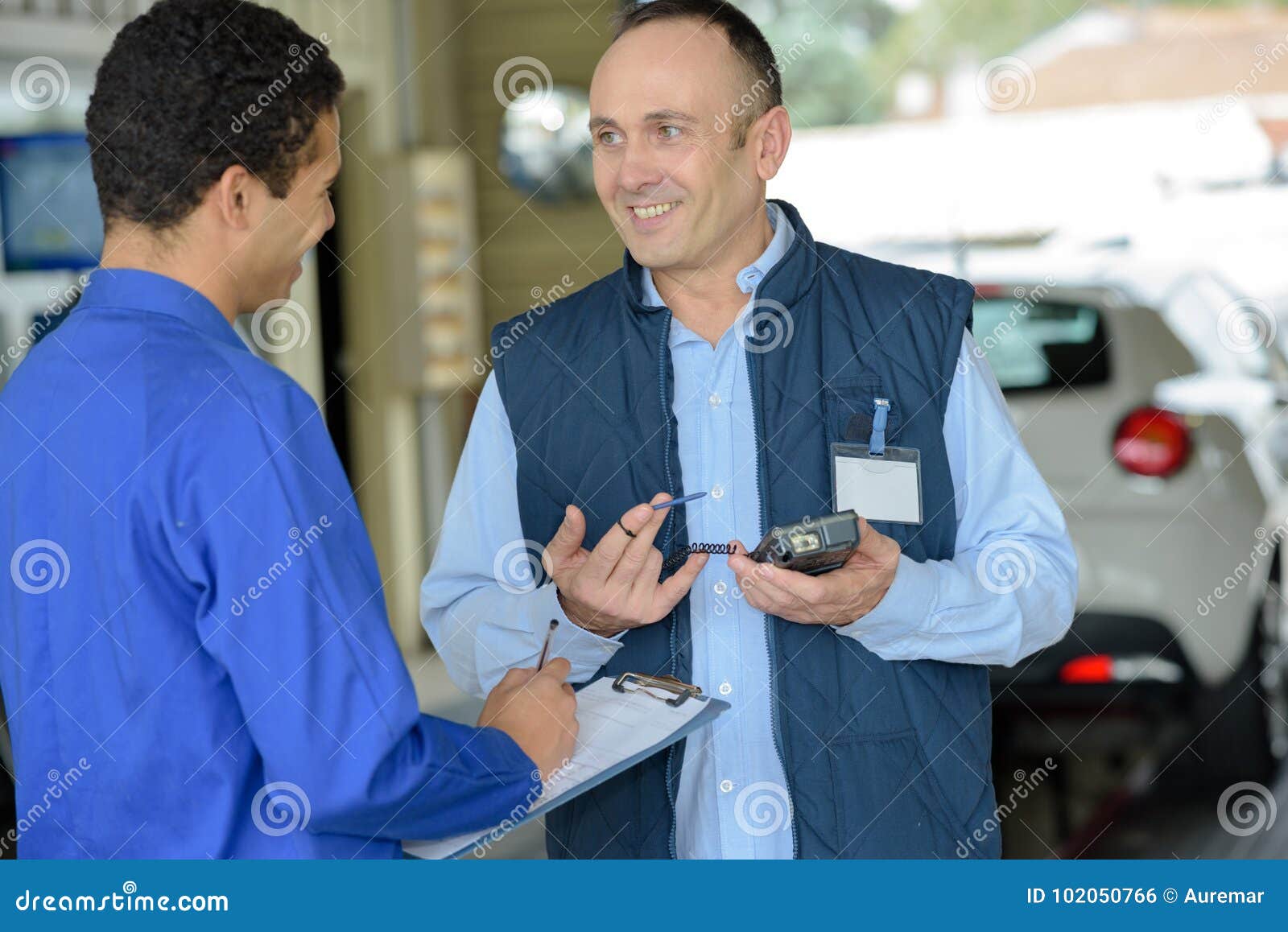Garage Worker Receiving Delivery Stock Photo - Image of male, delivery ...
