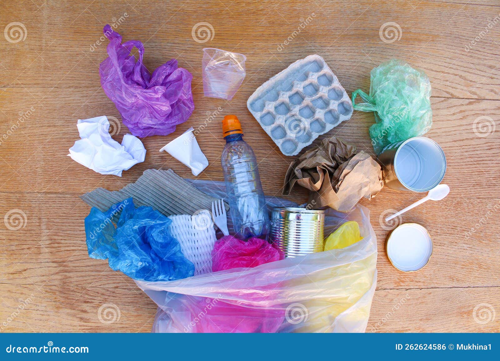 Garbage Bag with Different Trash on Wooden Background. Top View. Flat ...
