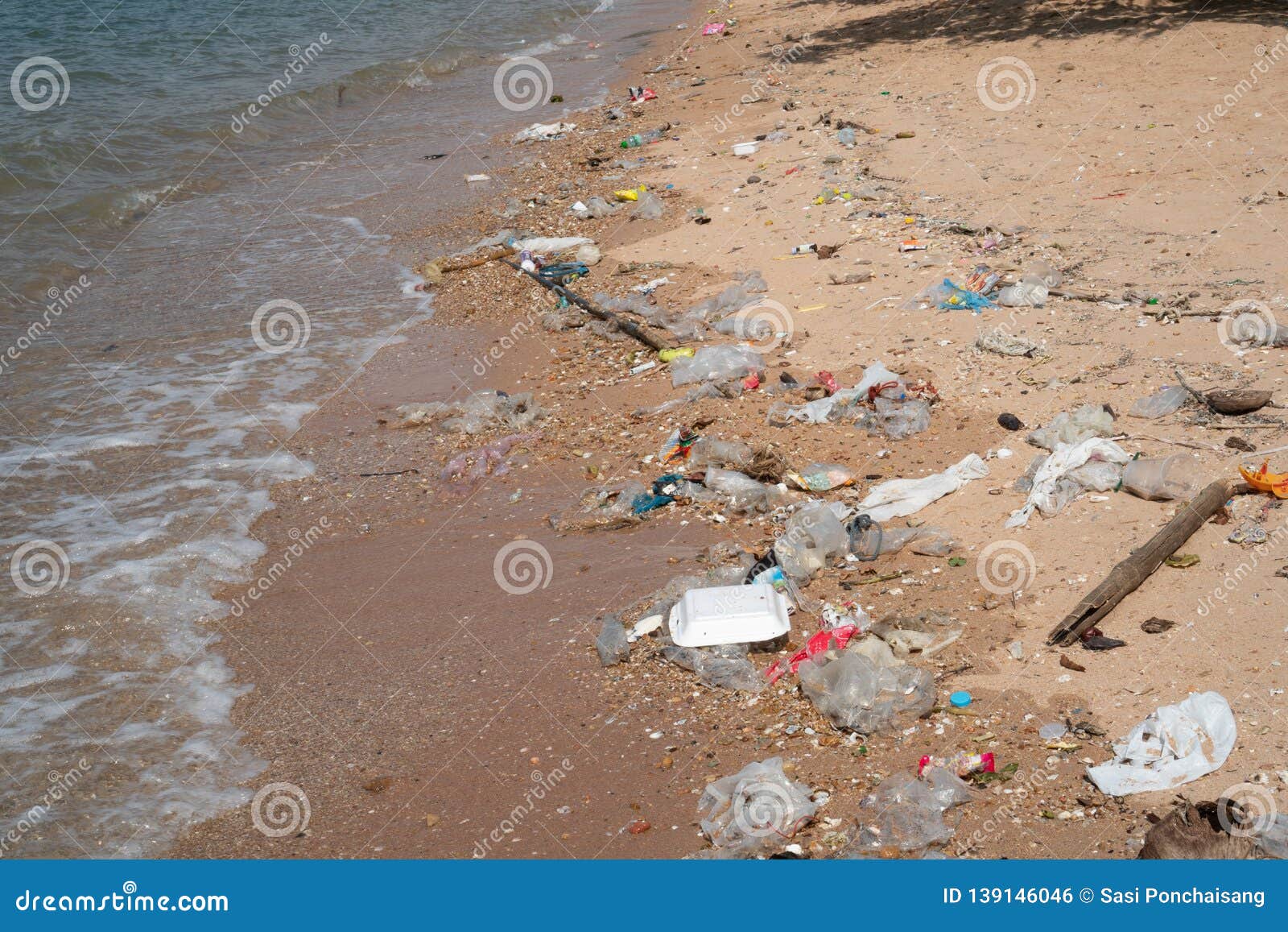 Garbage on the beach stock photo. Image of environment - 139146046