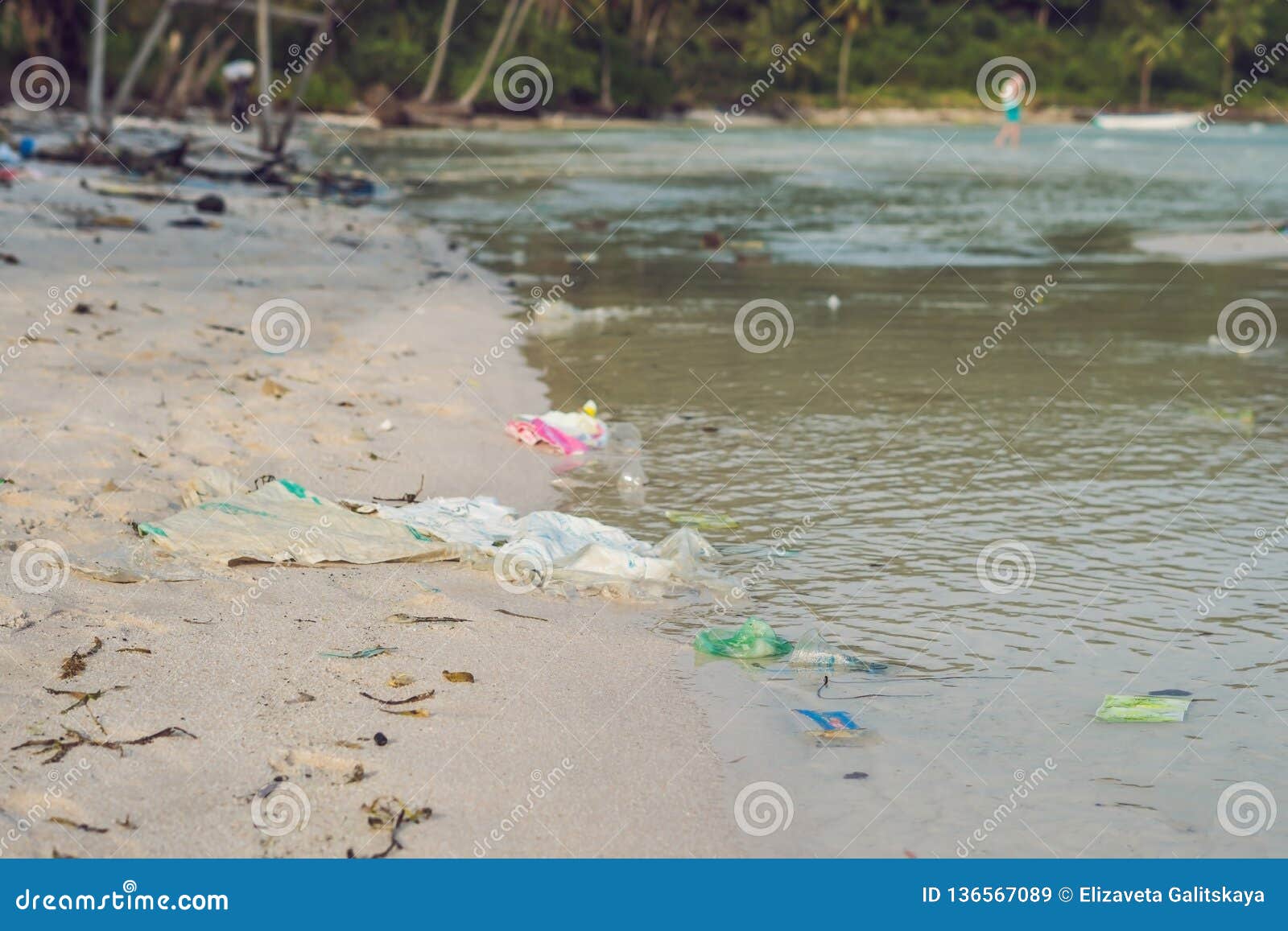 Garbage on a Beautiful Beach with White Sand. Contamination of the ...