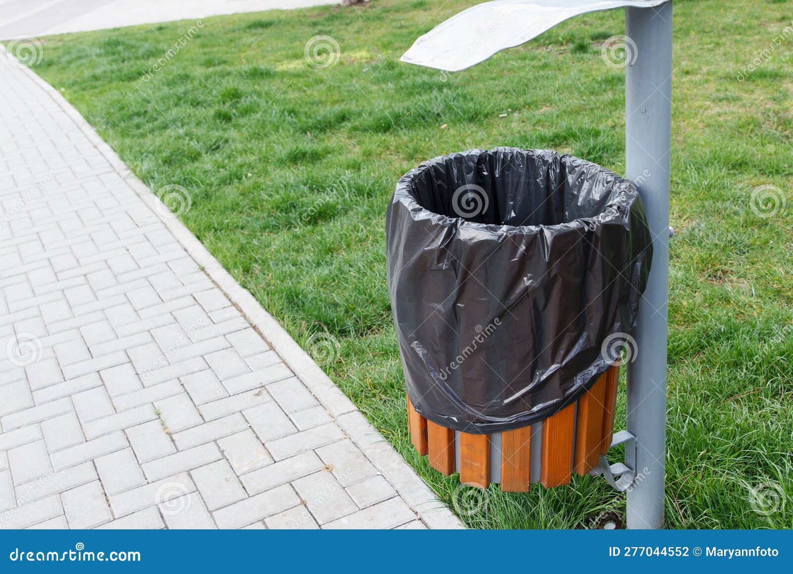 A Garbage Bin with a Garbage Bag is Installed in a Public Place ...