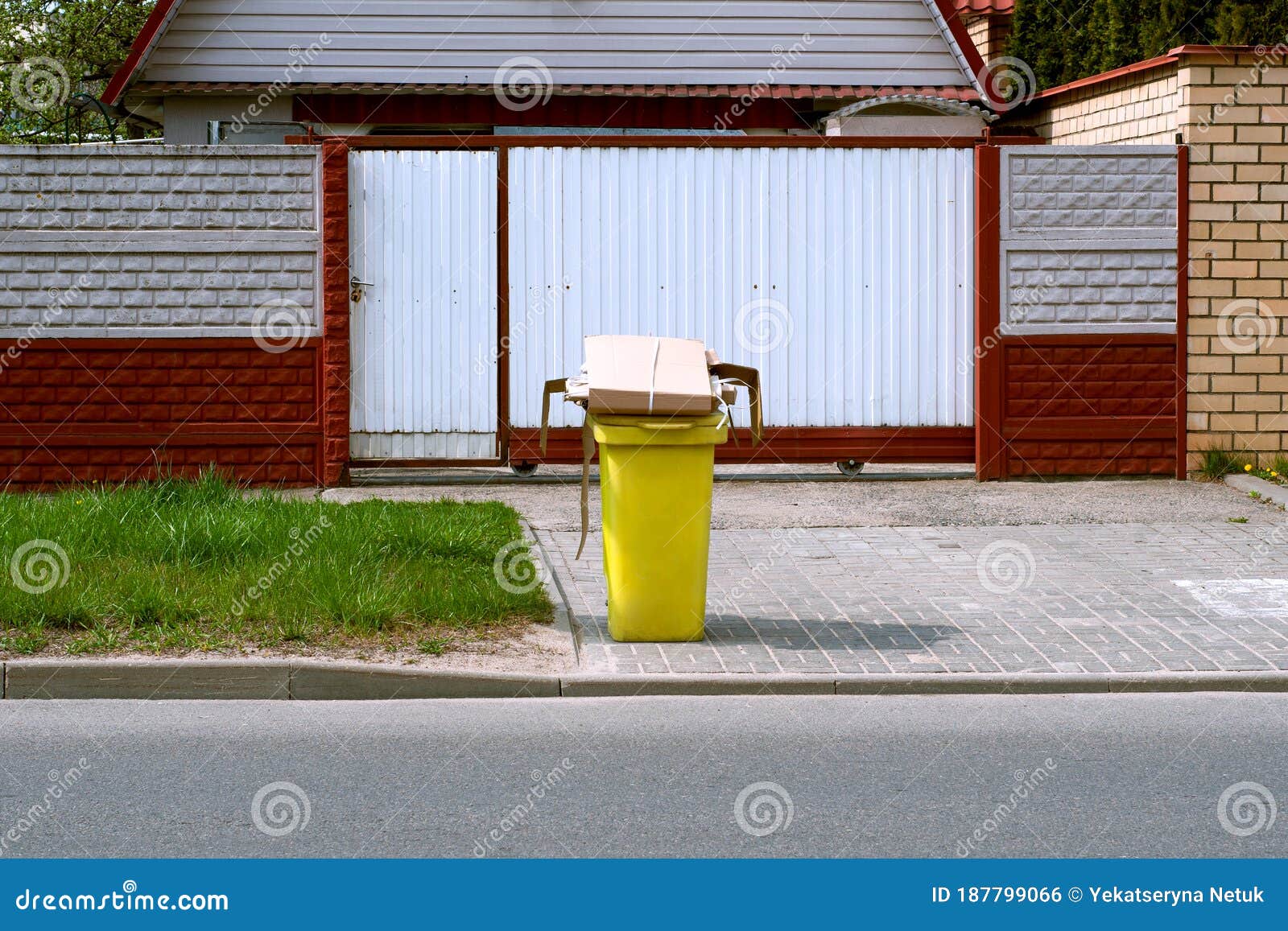 Garbage Bin with Paper in Front of the House.Public Trash on the Side ...