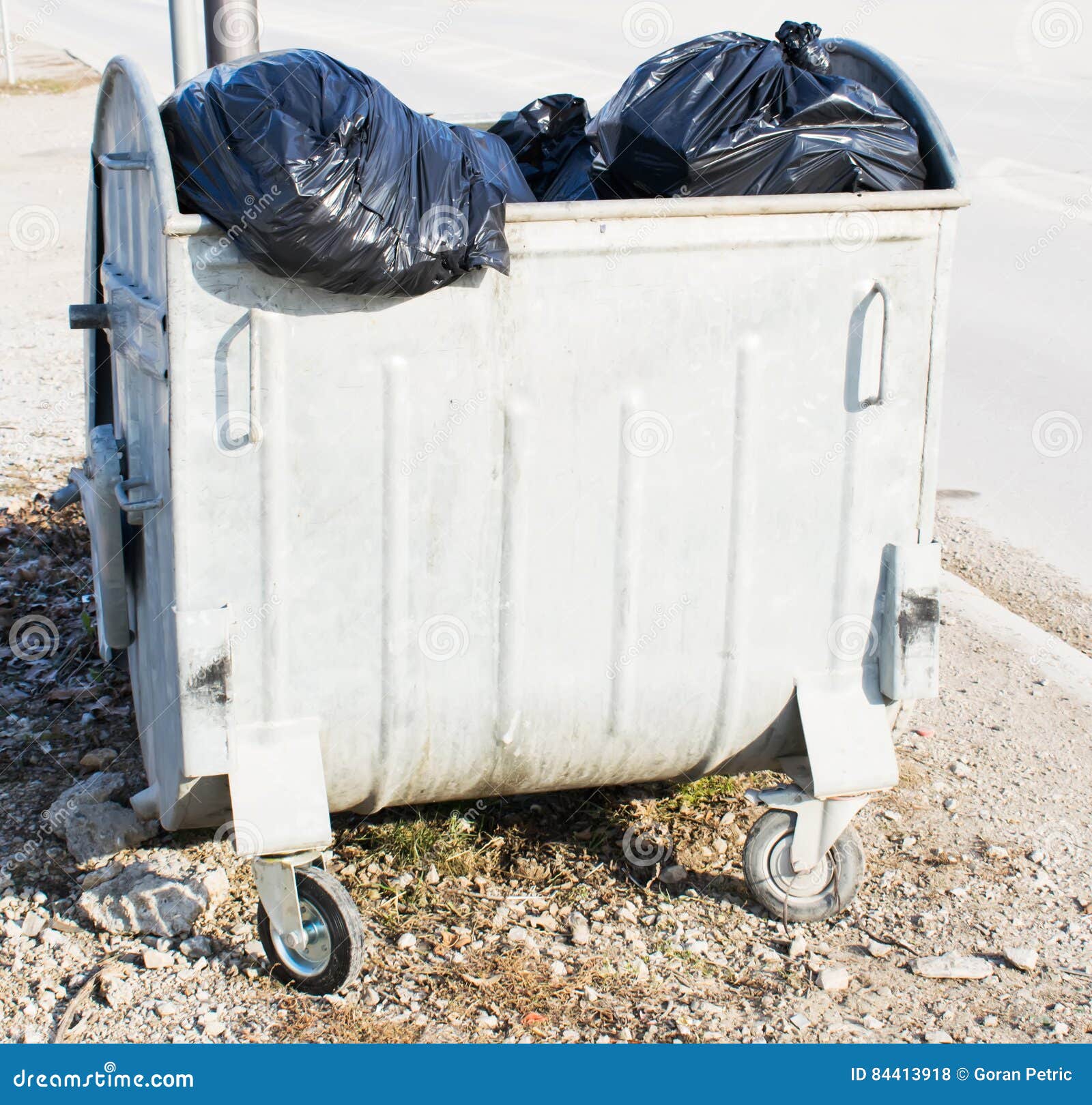 Garbage Bin with Trash Bags Stock Photo - Image of litter, environment ...