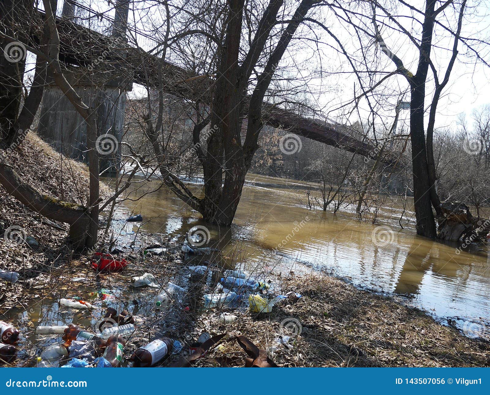 Garbage, Bottles, Mud in the Spring. Environmental Disaster Stock Photo ...