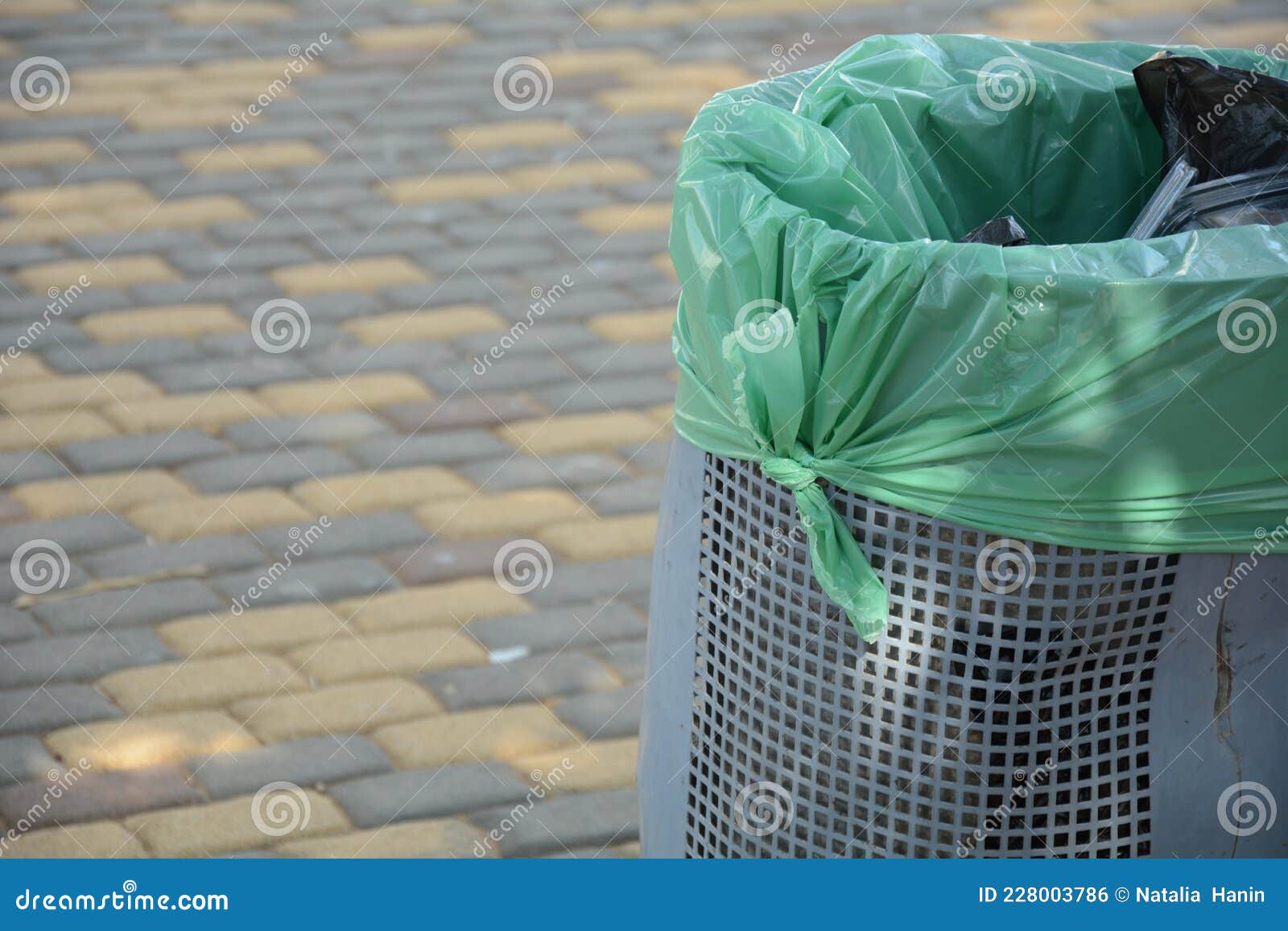 Garbage Can with a Plastic Bag on it, in a Street Stock Photo - Image ...
