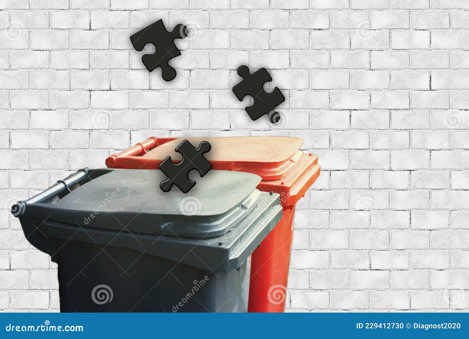 Garbage Can with Puzzles Pieces on White Brick Background. Separate ...