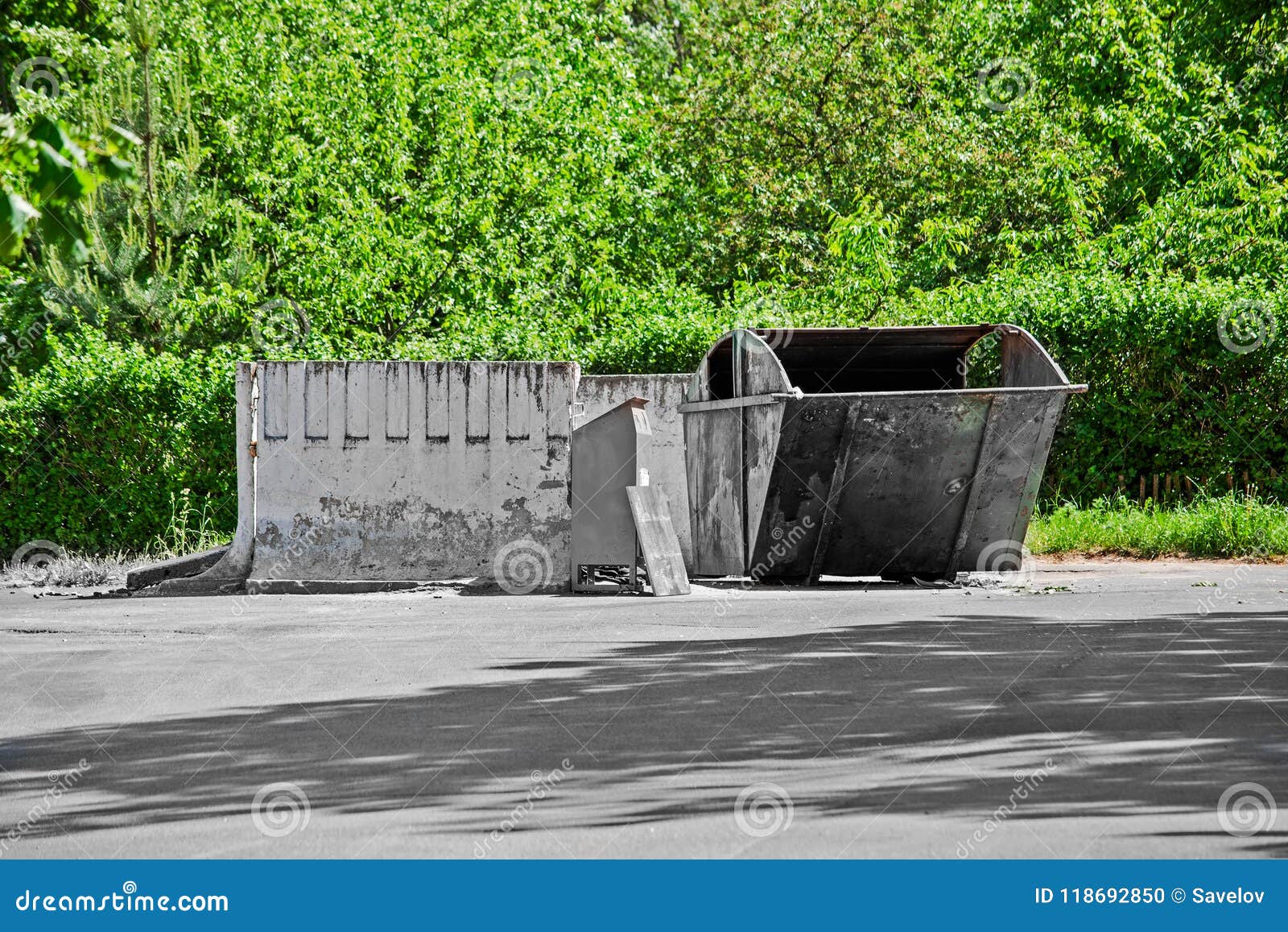 Large Garbage Cans Stand on the Asphalt among the Greenery Stock Photo ...