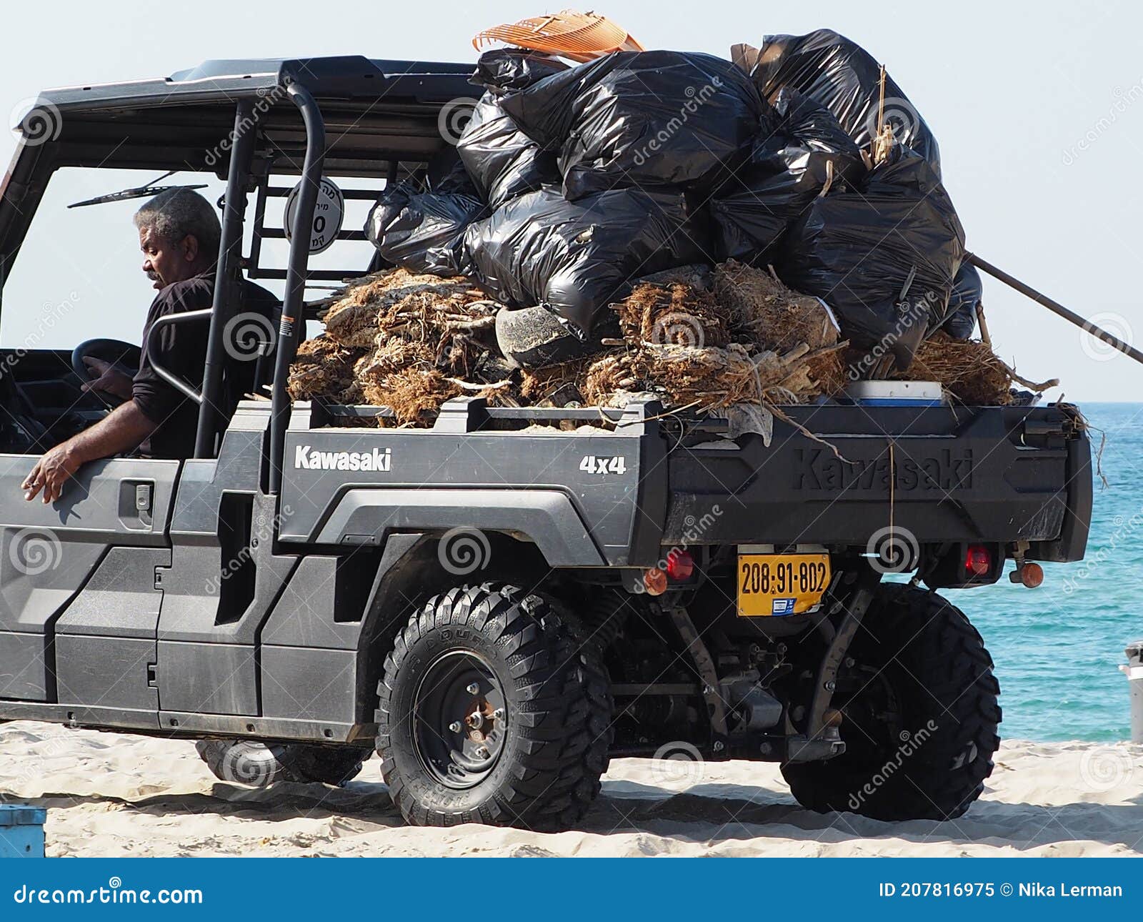 Garbage Collection on a Beach Editorial Image - Image of sand, worker ...