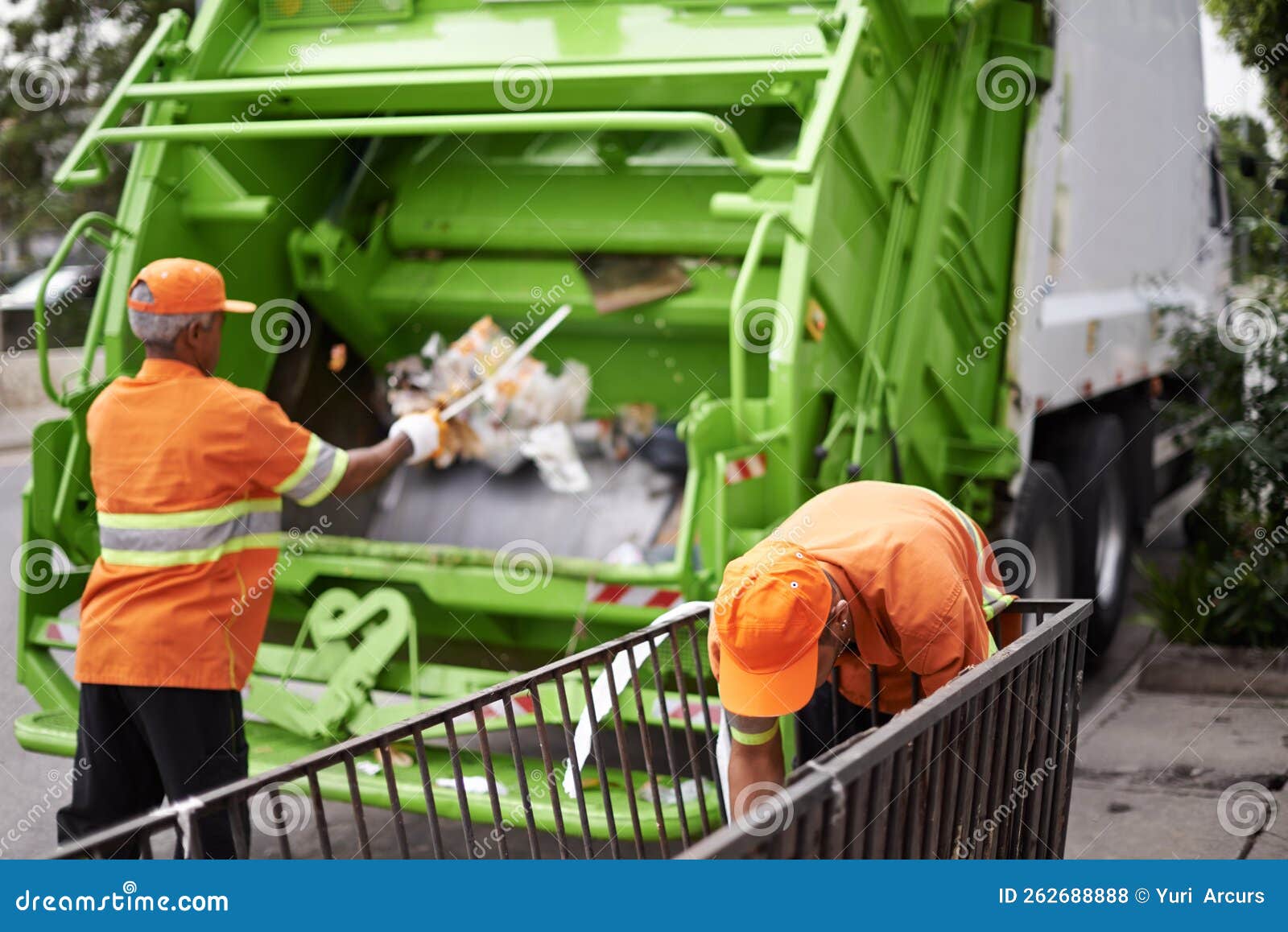 Garbage Collection Day. a Garbage Collection Team at Work. Stock Photo ...