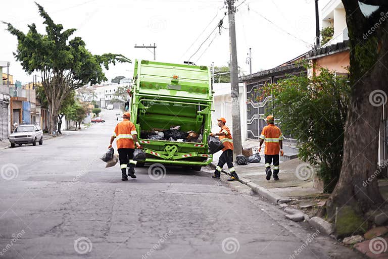 Garbage Collection Day. a Garbage Collection Team at Work. Stock Photo ...