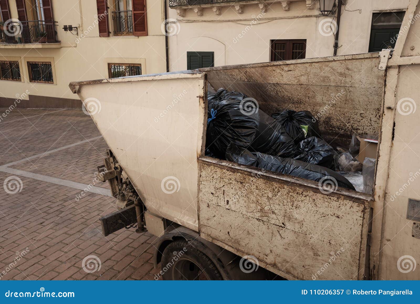 Garbage collection van stock image. Image of beggar - 110206357