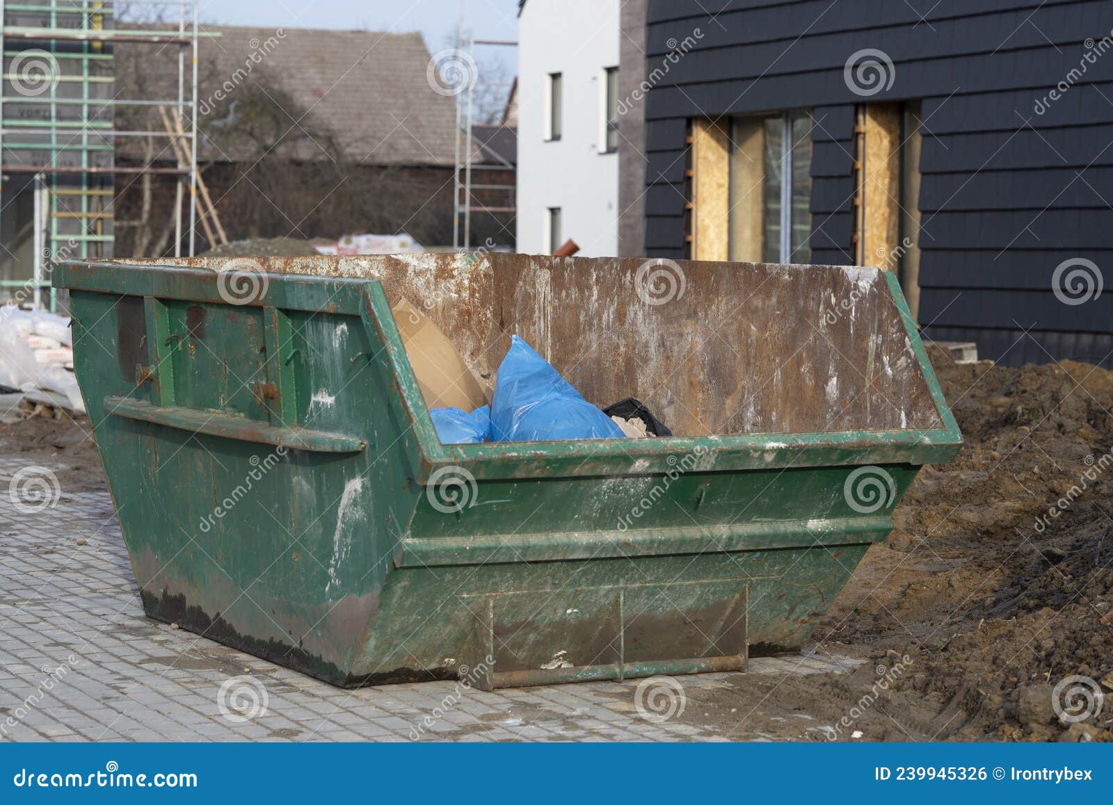 Garbage Container at Construction Site Stock Photo - Image of pavement ...