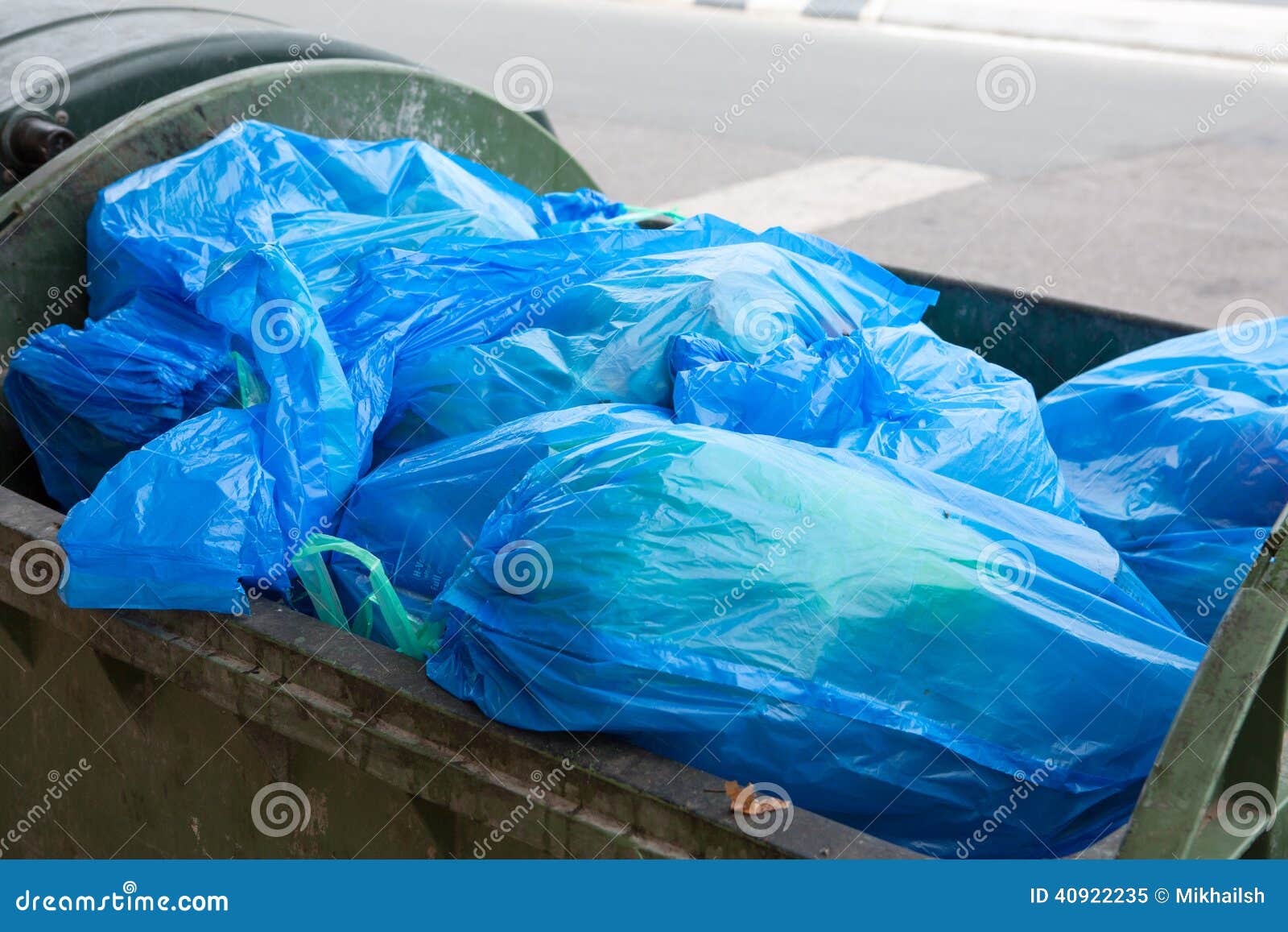 Garbage Container Filled with Blue Bags Stock Image - Image of plastic ...