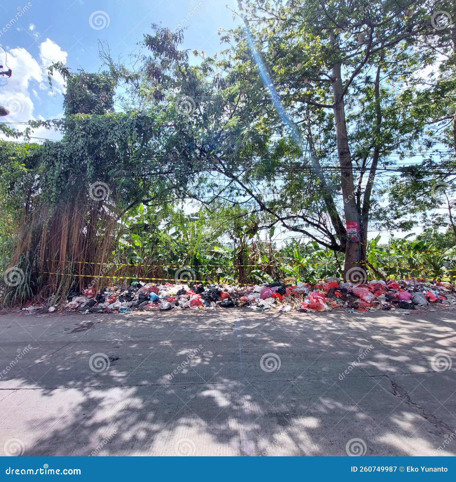 Garbage Disposal Area on the Side of the Road that is Installed with a ...