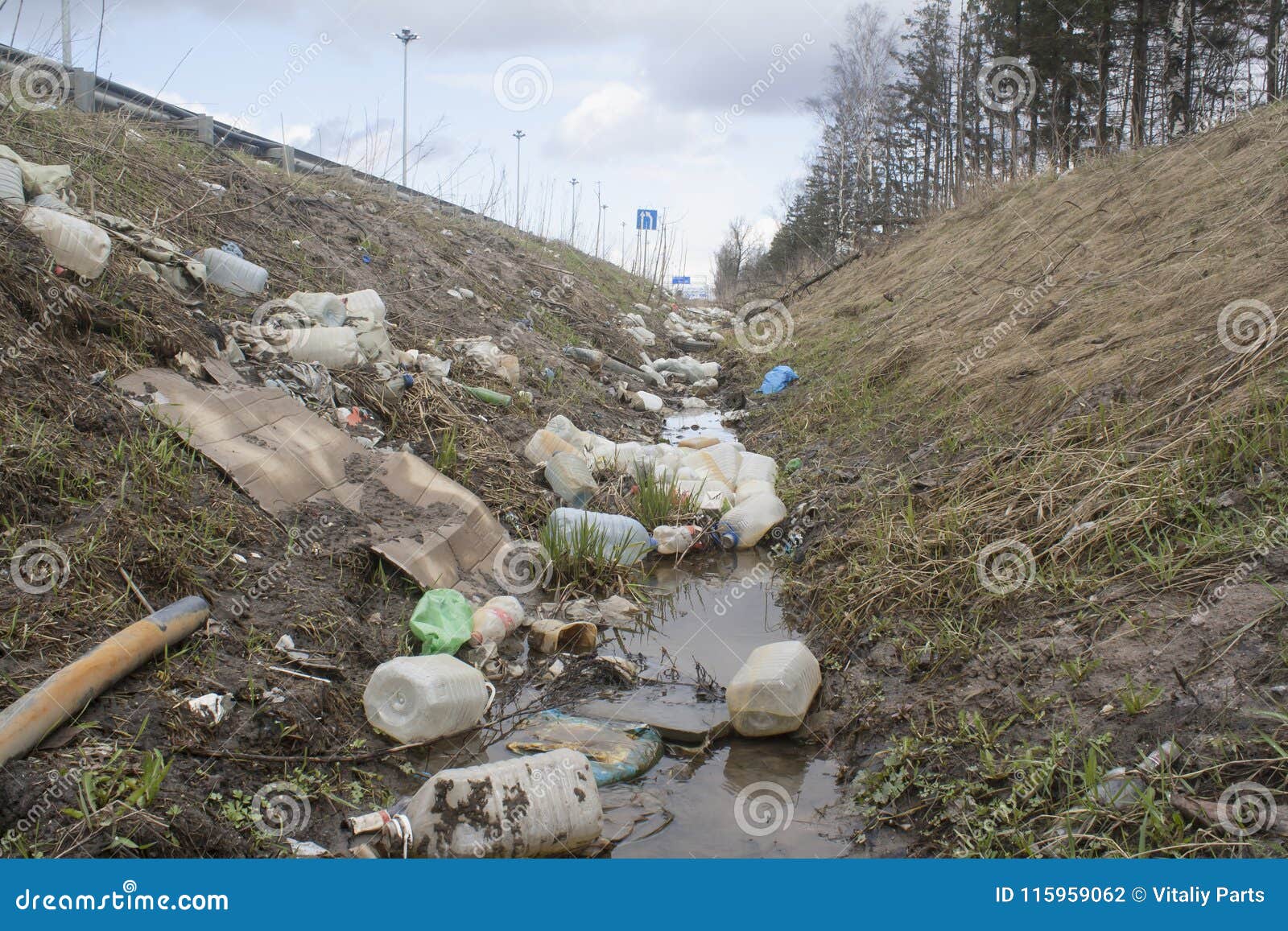 Trash in a roadside ditch stock photo. Image of garbage - 115959062