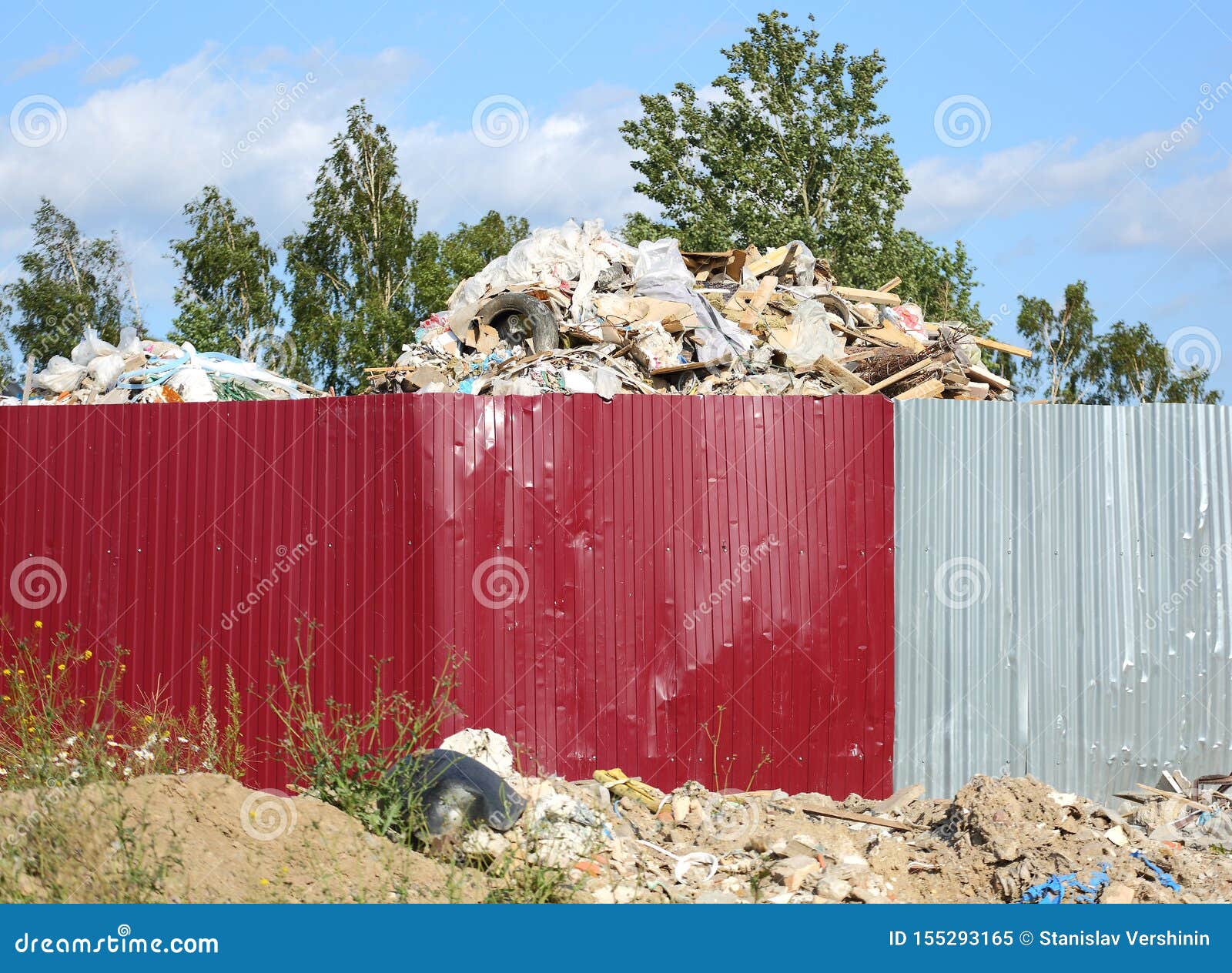 Garbage Dump Behind a Brown Metal Fence Stock Image - Image of blue ...