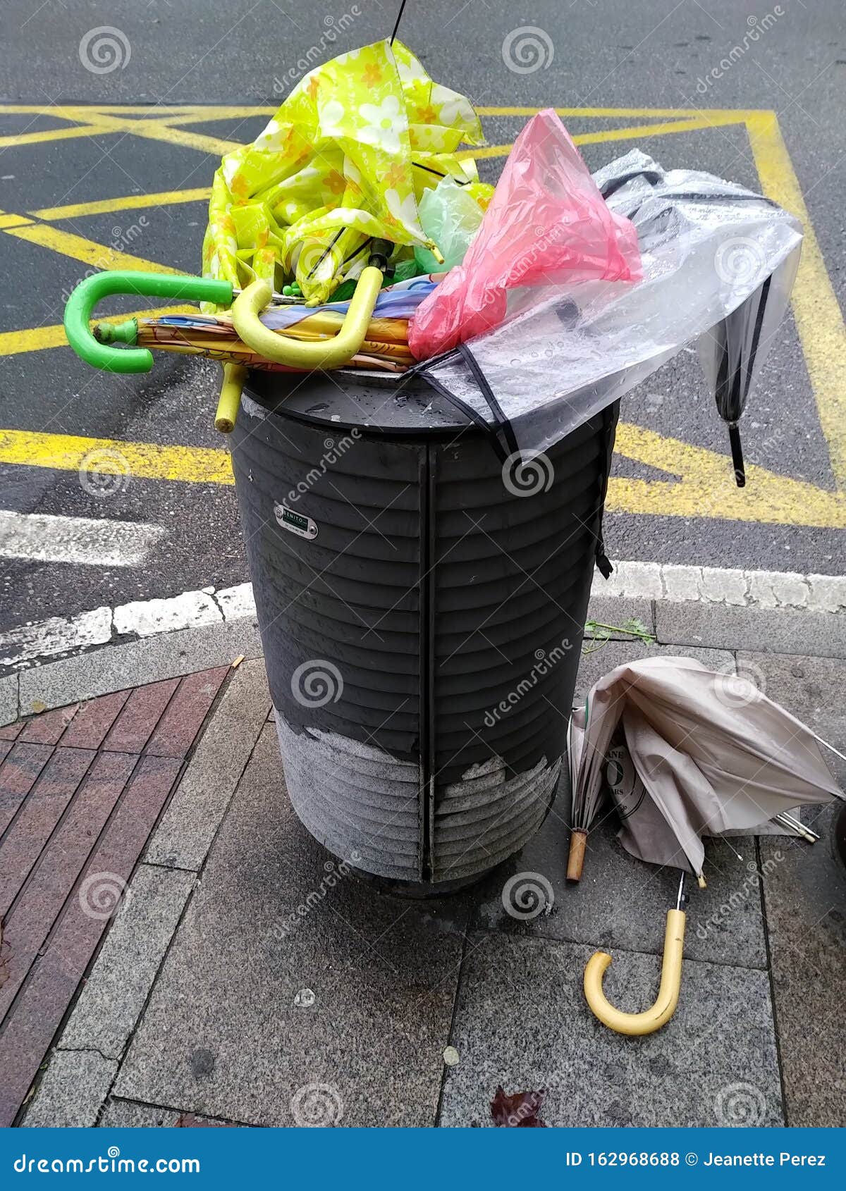 Garbage Dump with Colored Umbrellas Damaged by Heavy Rain. Stock Photo ...