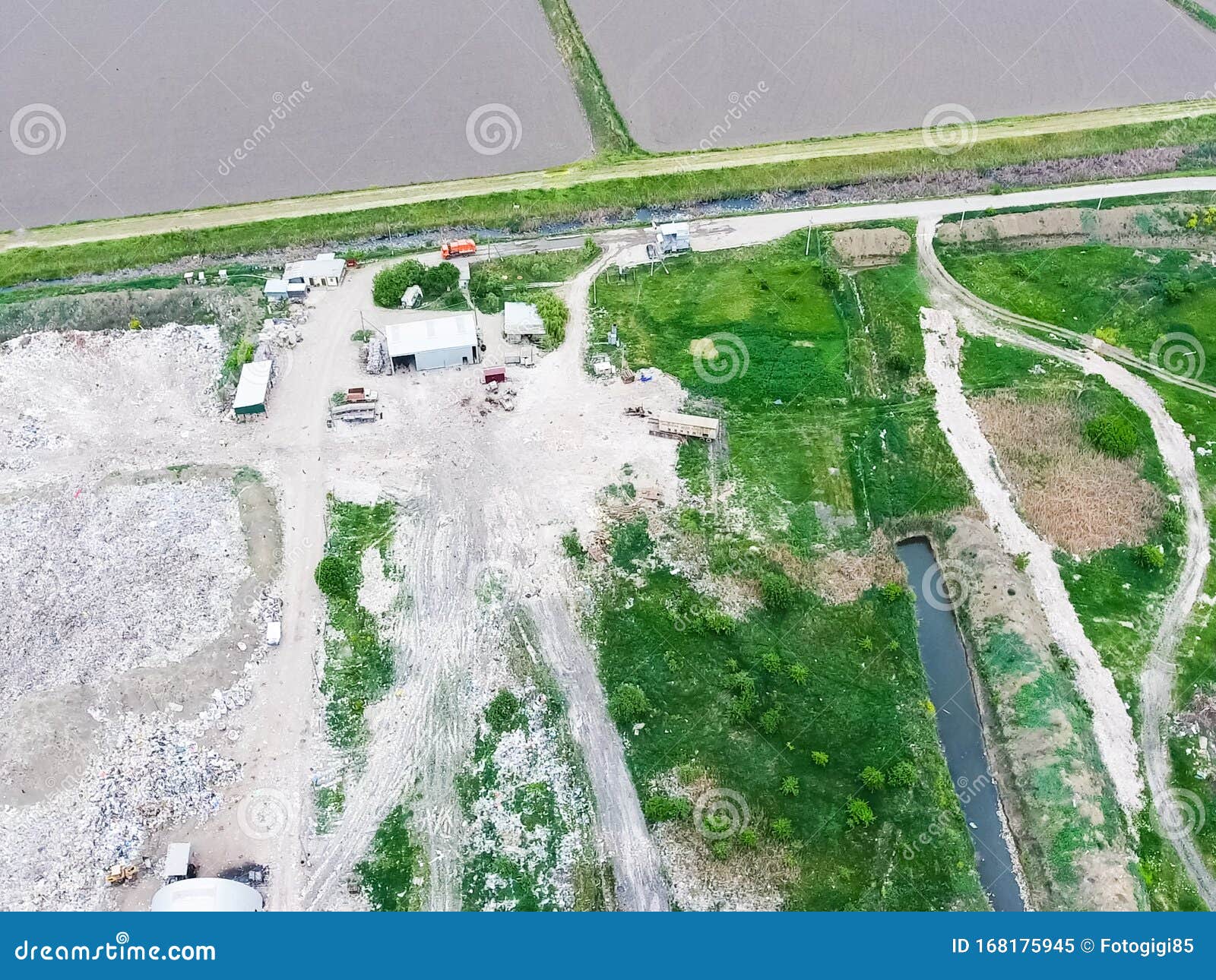 Dump with Heaps of Garbage and Treatment Facilities. Landfill of ...