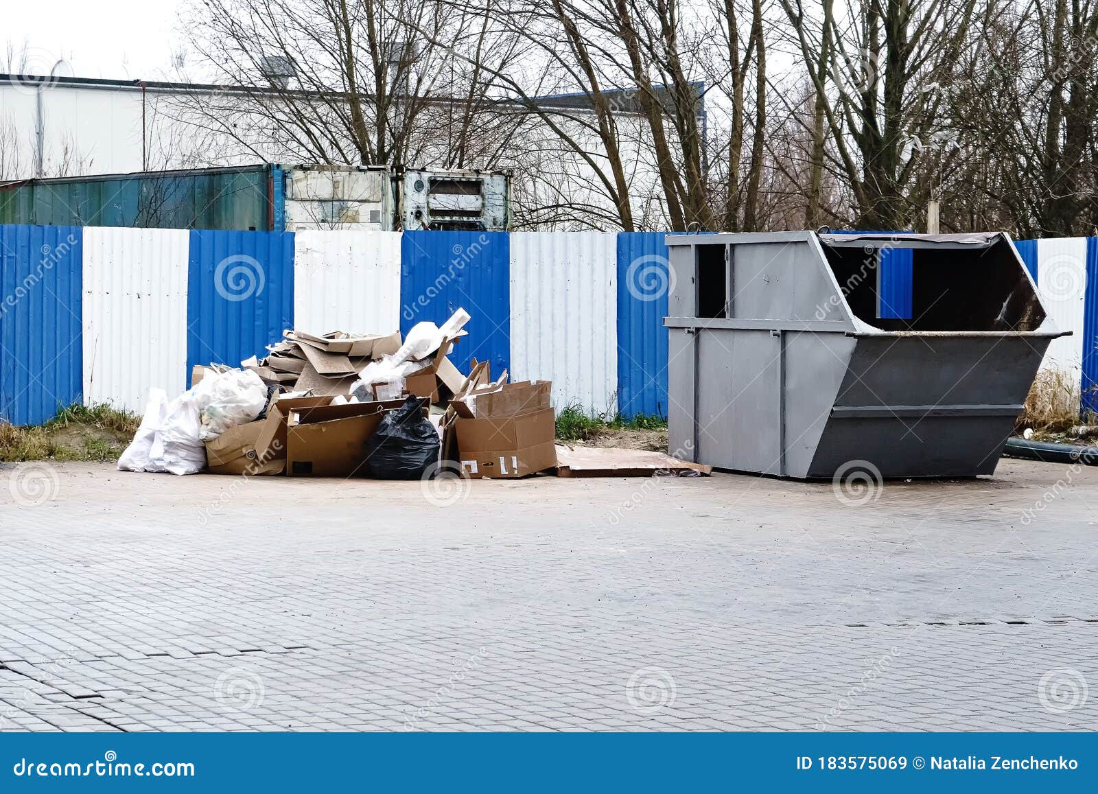 Empty Trash Can on the Street. Garbage is Lying Near. Stock Image ...