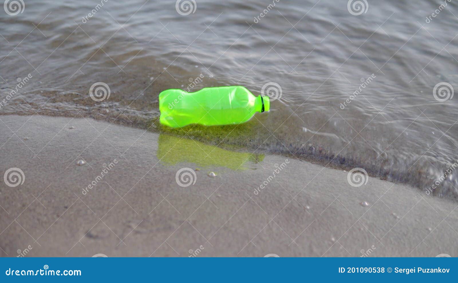 Garbage in the Form of a Plastic Bottle Floats in the River, Lake Close ...