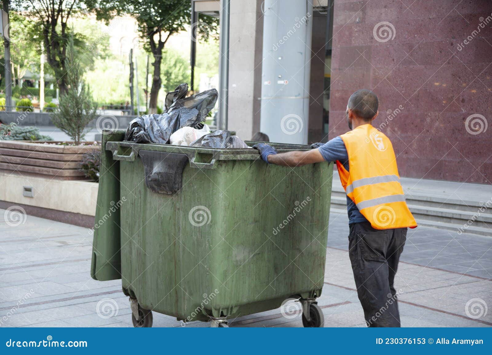 Garbage man and trash can editorial stock photo. Image of city - 230376153