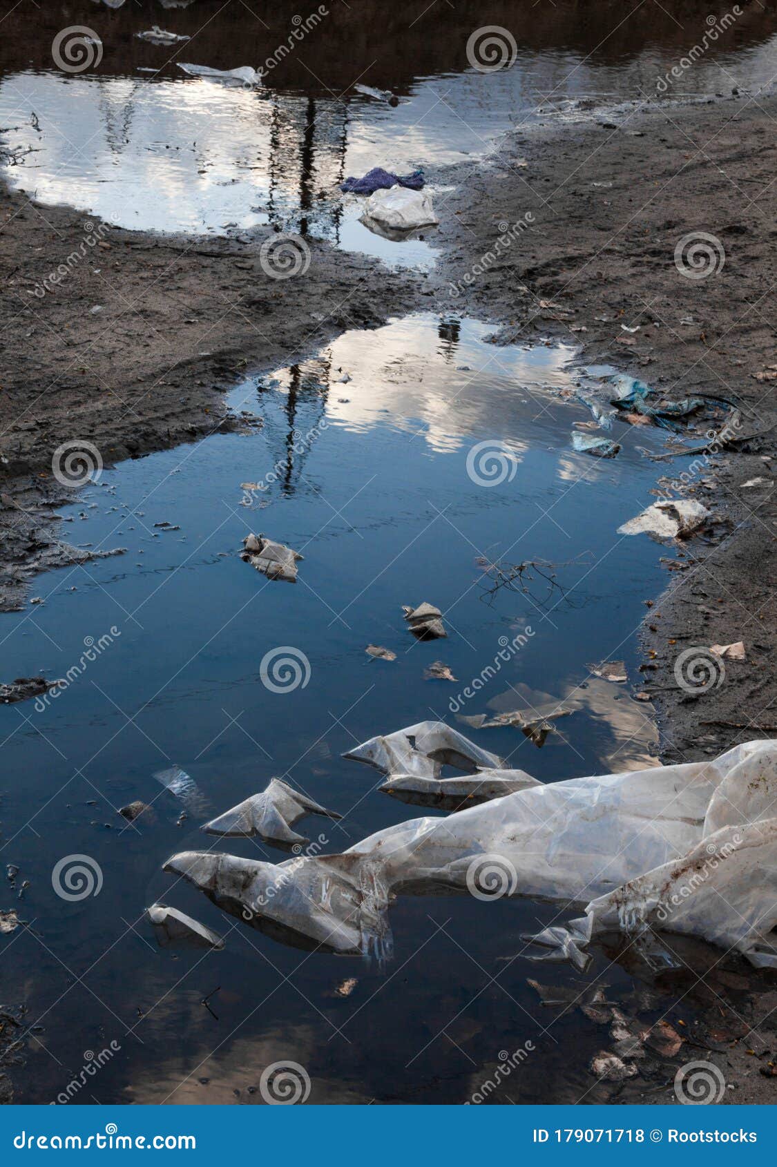 Garbage in the Mud on the Dirt Road Stock Photo - Image of pollution ...