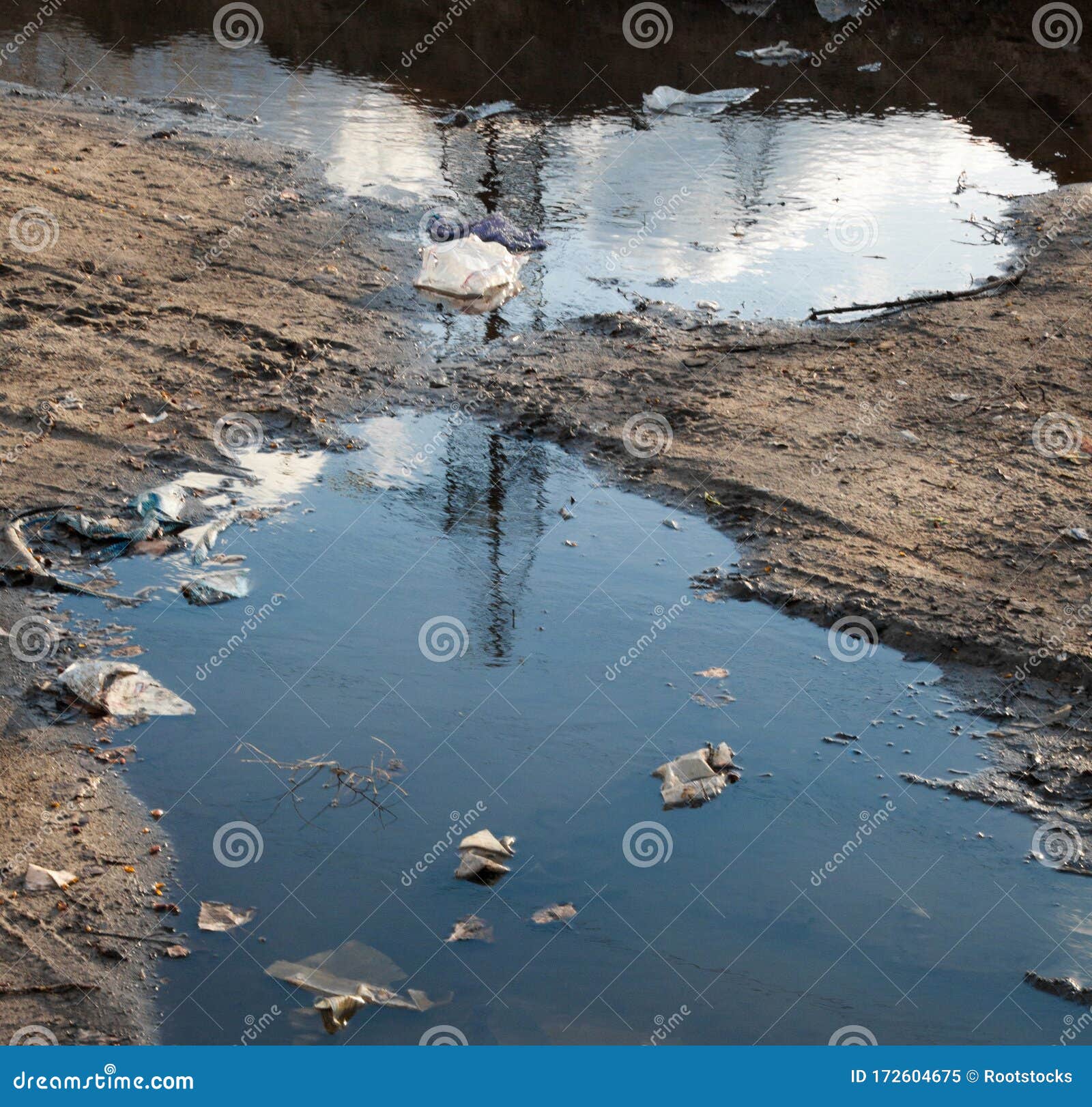 Garbage in the Mud on the Dirt Road Stock Image - Image of polythene ...