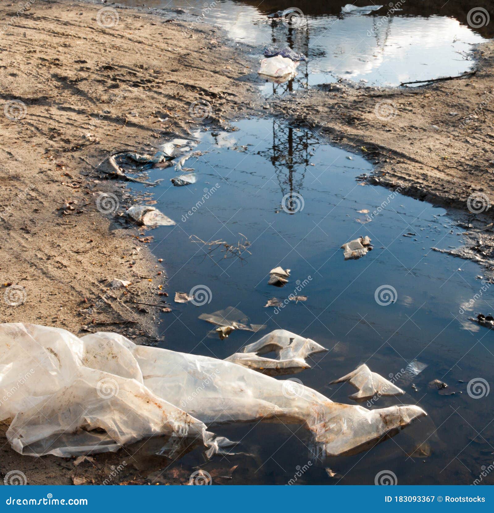 Garbage in the Mud on the Dirt Road Stock Image - Image of garbage ...