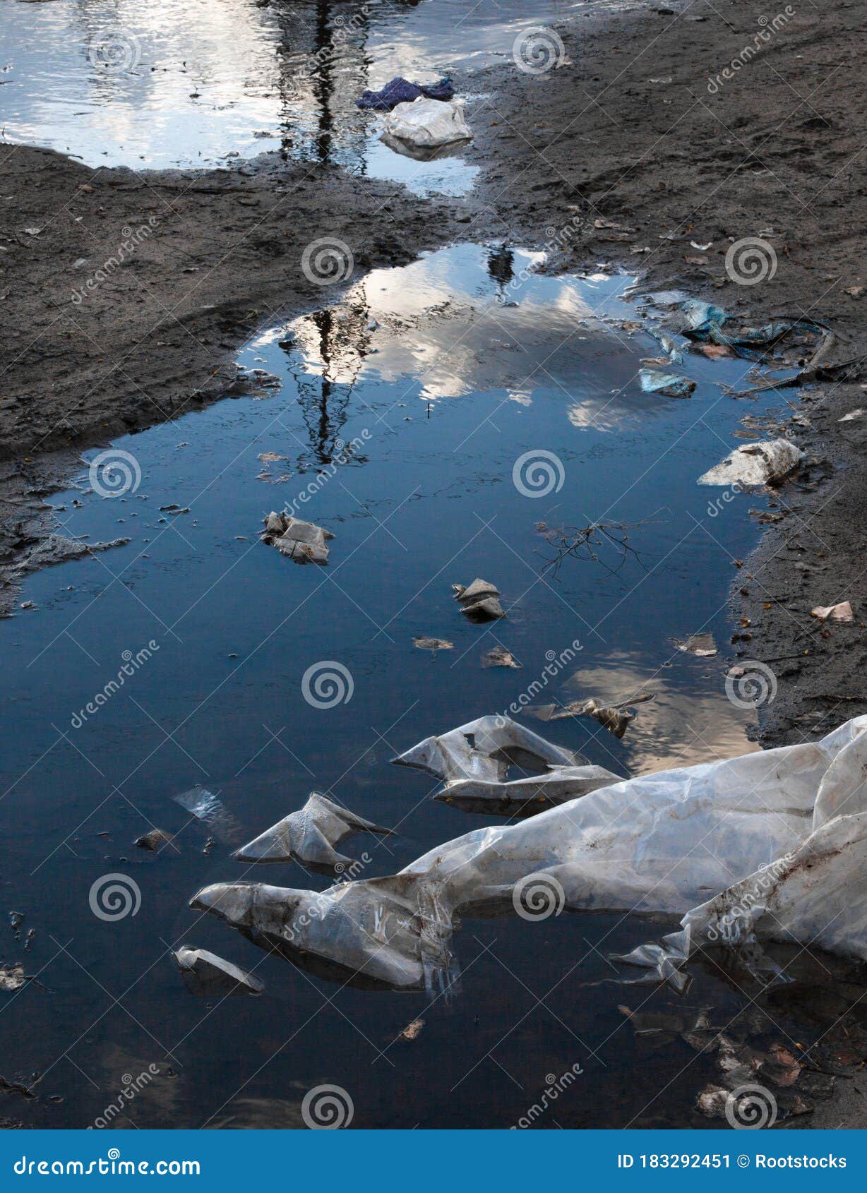 Garbage in the Mud on the Dirt Road Stock Image - Image of polythene ...