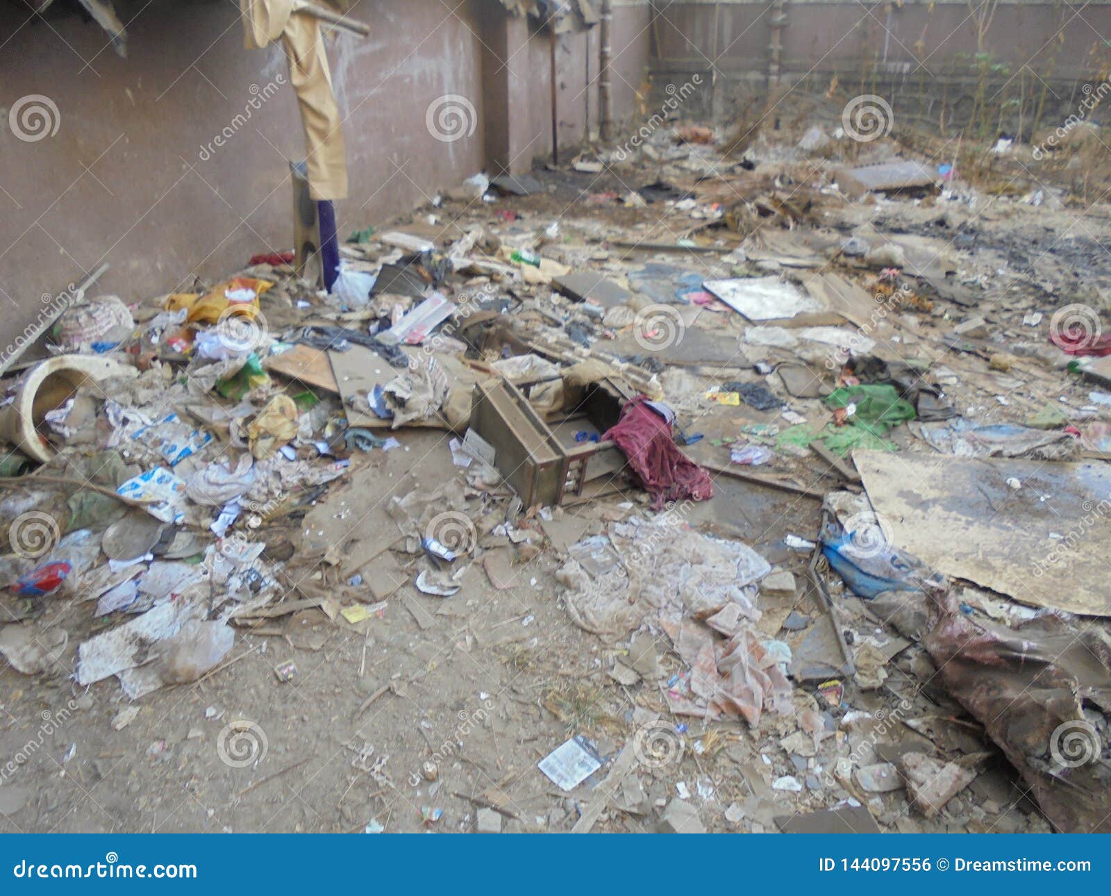 Garbage in a open plot stock photo. Image of environment - 144097556