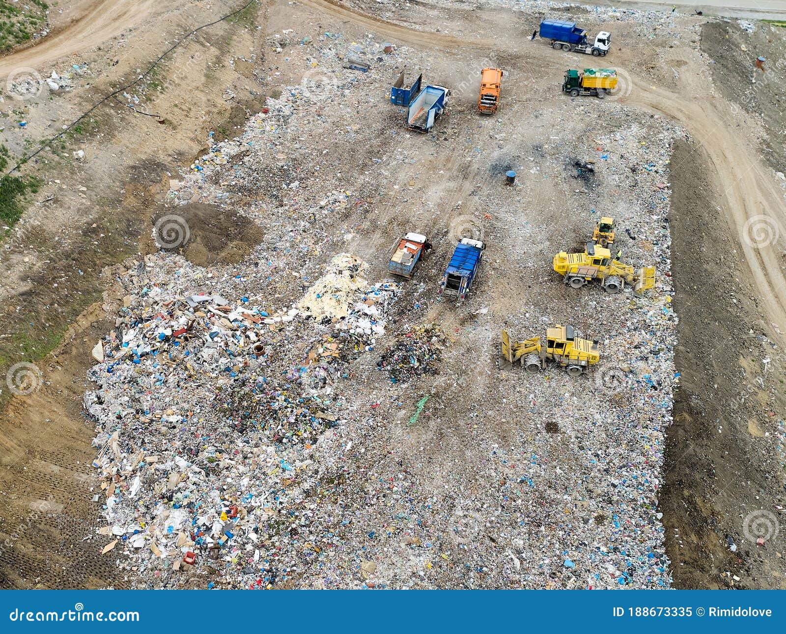 Garbage Pile in Trash Dump or Landfill. Dump Trucks and Excavators ...