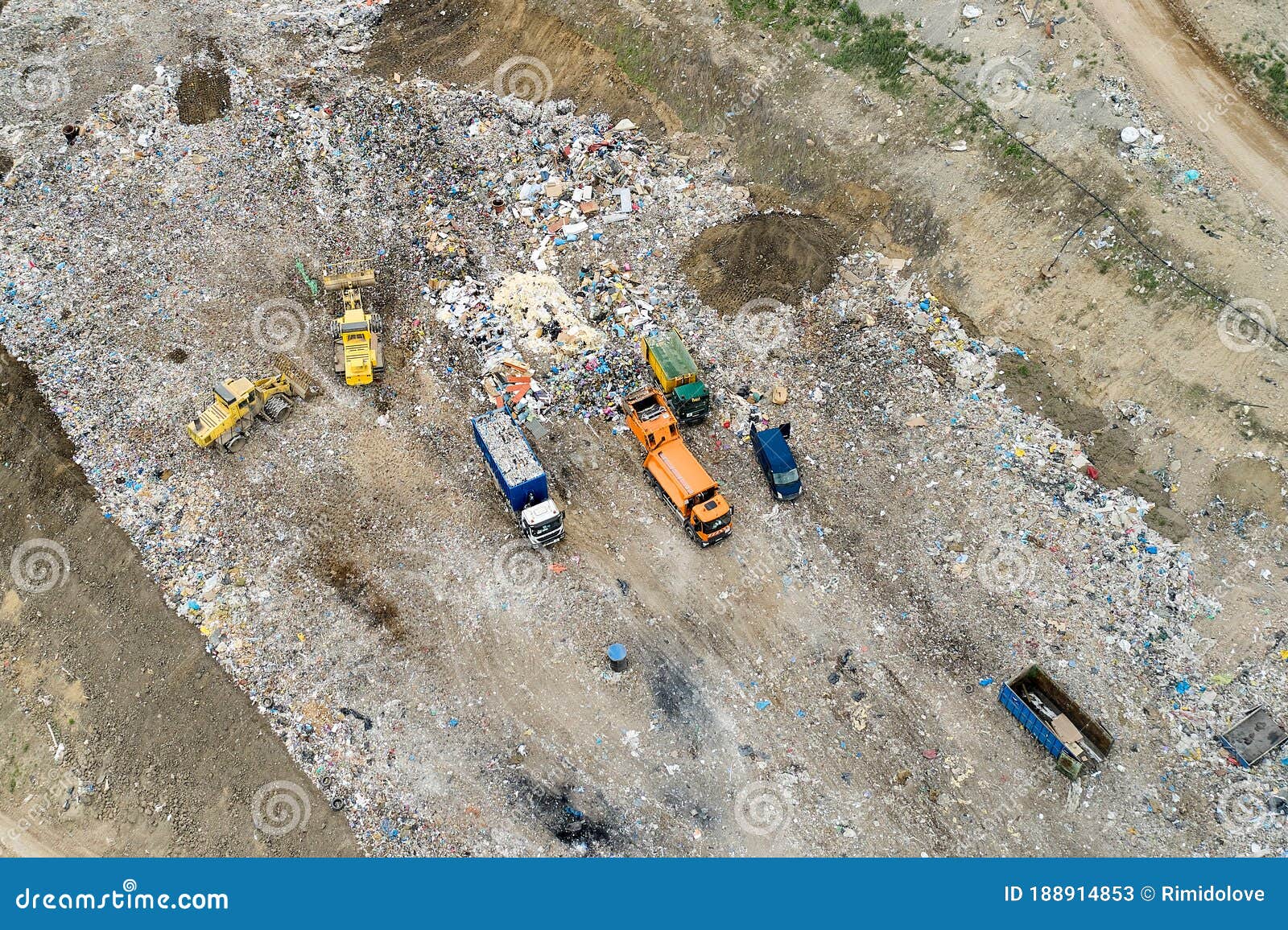 Garbage Pile in Trash Dump or Landfill. Dump Trucks and Excavators ...