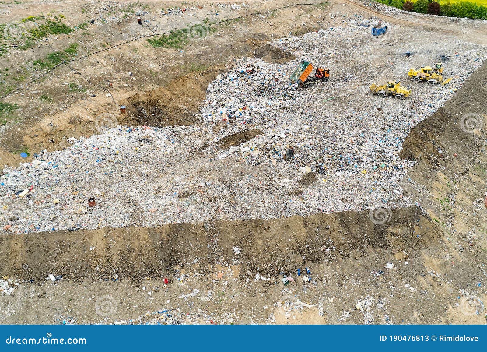 Garbage Pile in Trash Dump or Landfill. Dump Trucks and Excavators ...