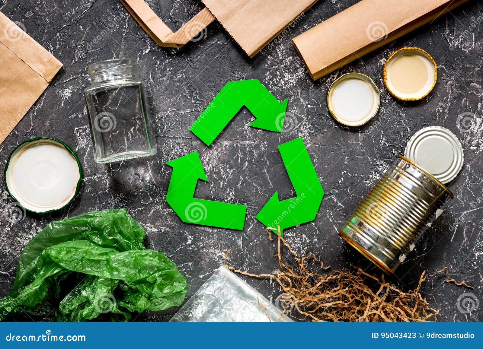 Garbage for Recycling with Recycling Symbol on Grey Table Background ...