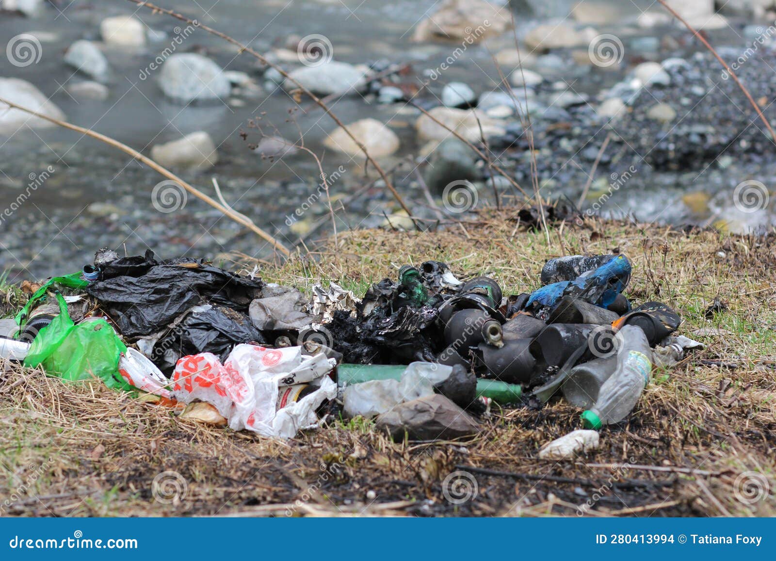 Garbage on river bank stock photo. Image of deposit - 280413994