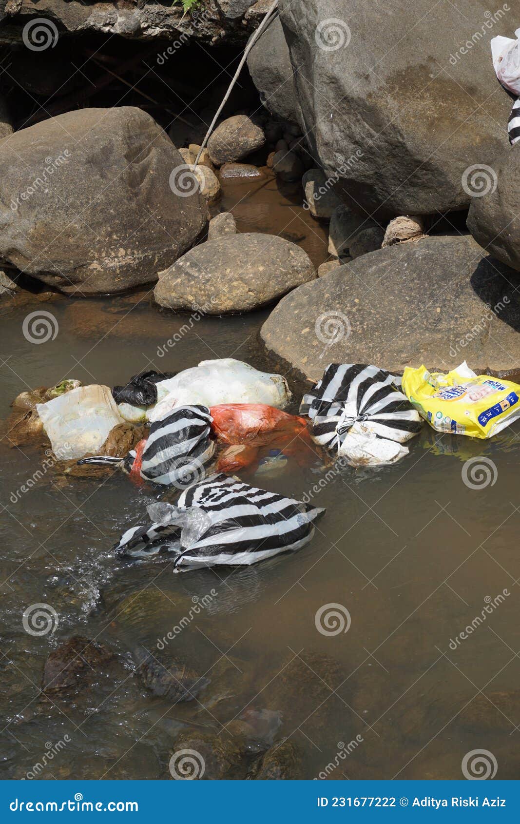 The Garbage in the River with Rock Background Editorial Photography ...