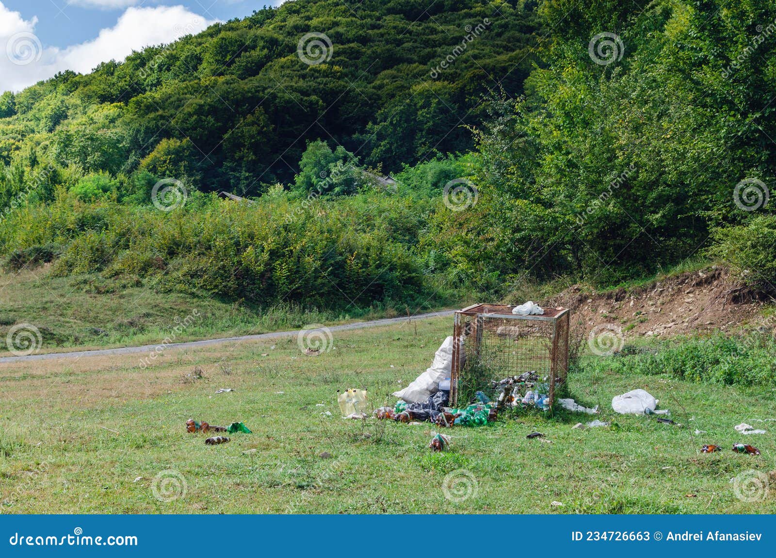 Garbage Scattered Around a Dumpster in Nature, Environmental Pollution ...
