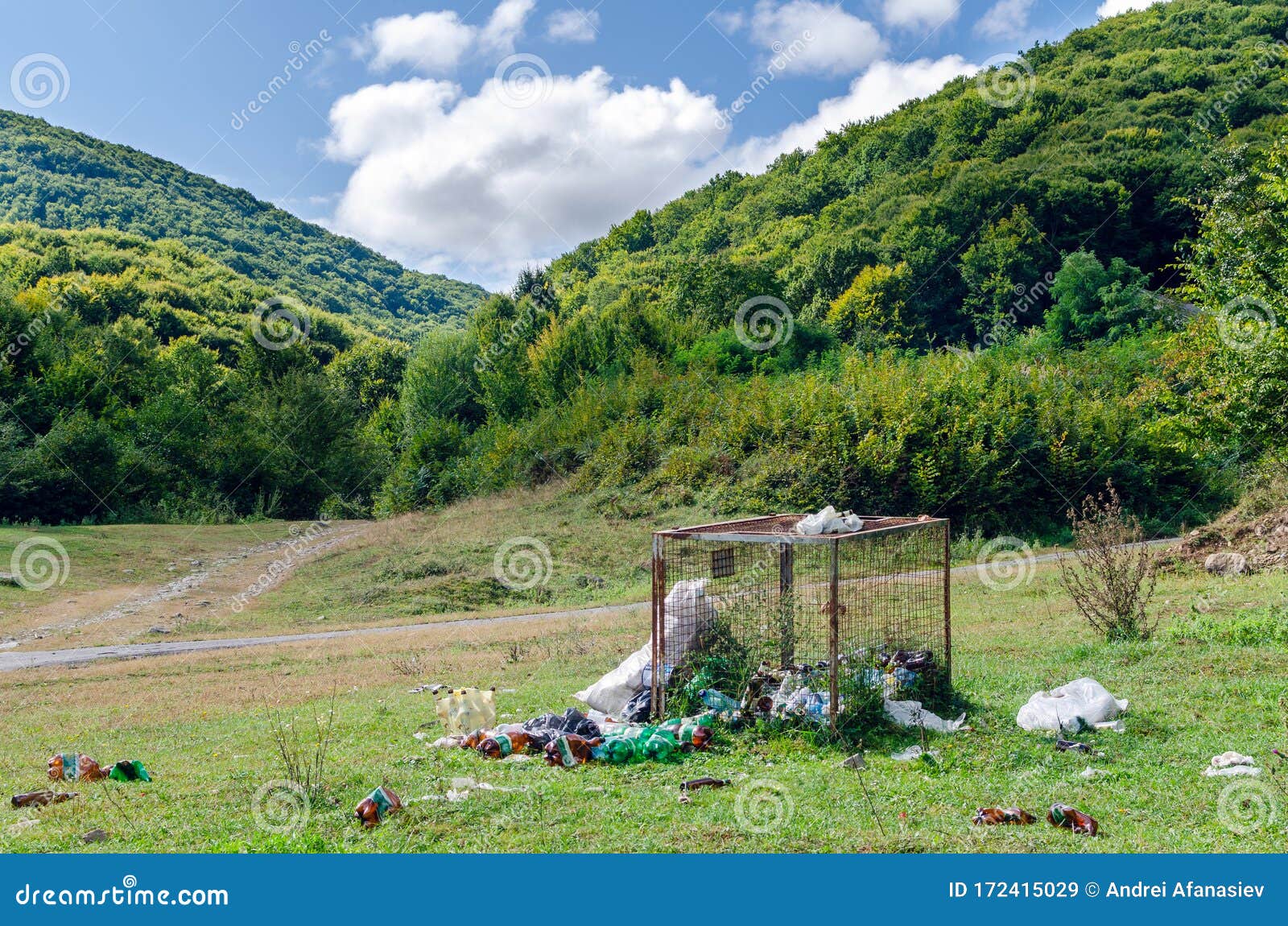 Garbage Scattered Around a Dumpster in Nature, Environmental Pollution ...