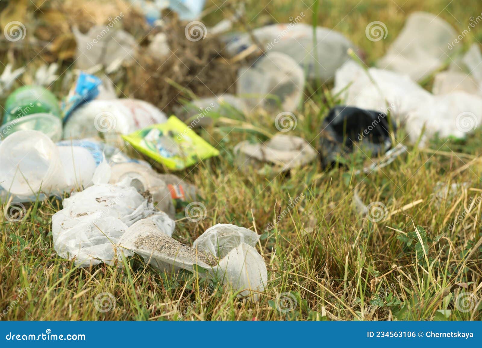 Garbage Scattered on Grass. Environment Pollution Problem Stock Photo ... Garbage Scattered on Grass. Environment Pollution Problem Stock Photo ...