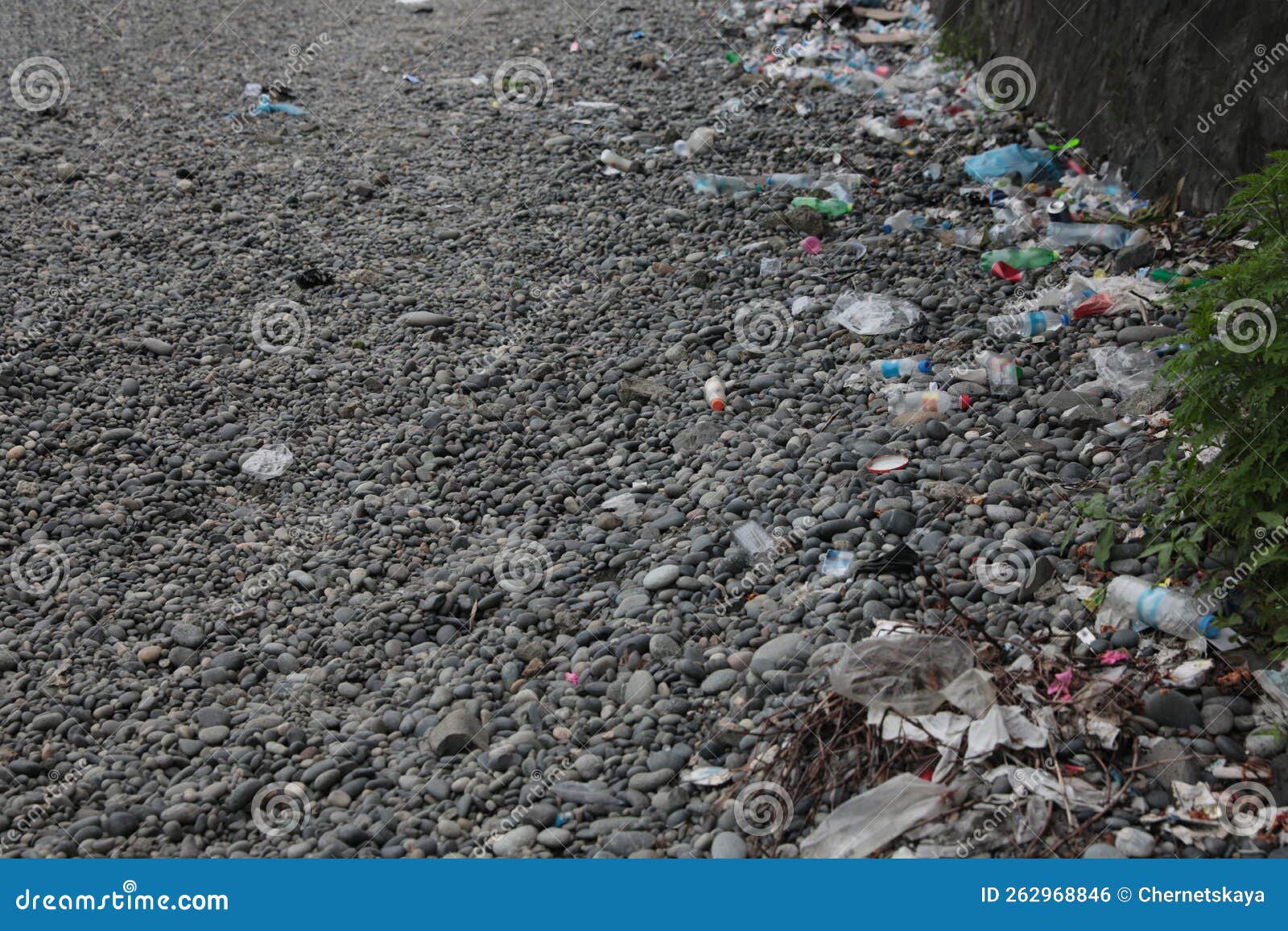 Garbage Scattered on Pebbles Outdoors. Recycling Problem Stock Photo ...