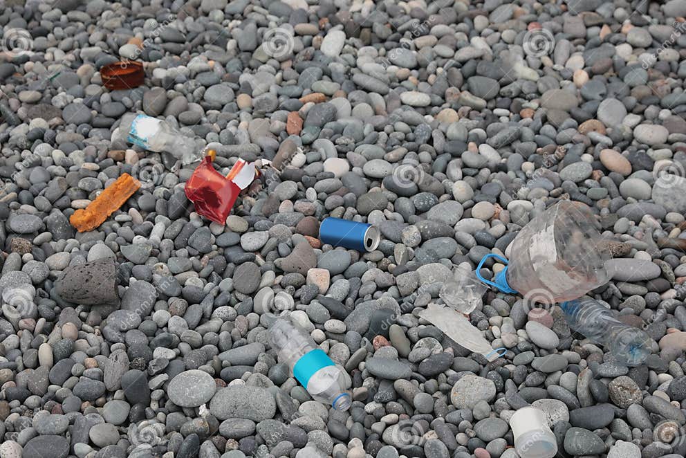 Garbage Scattered on Pebbles Outdoors. Recycling Problem Stock Photo ...