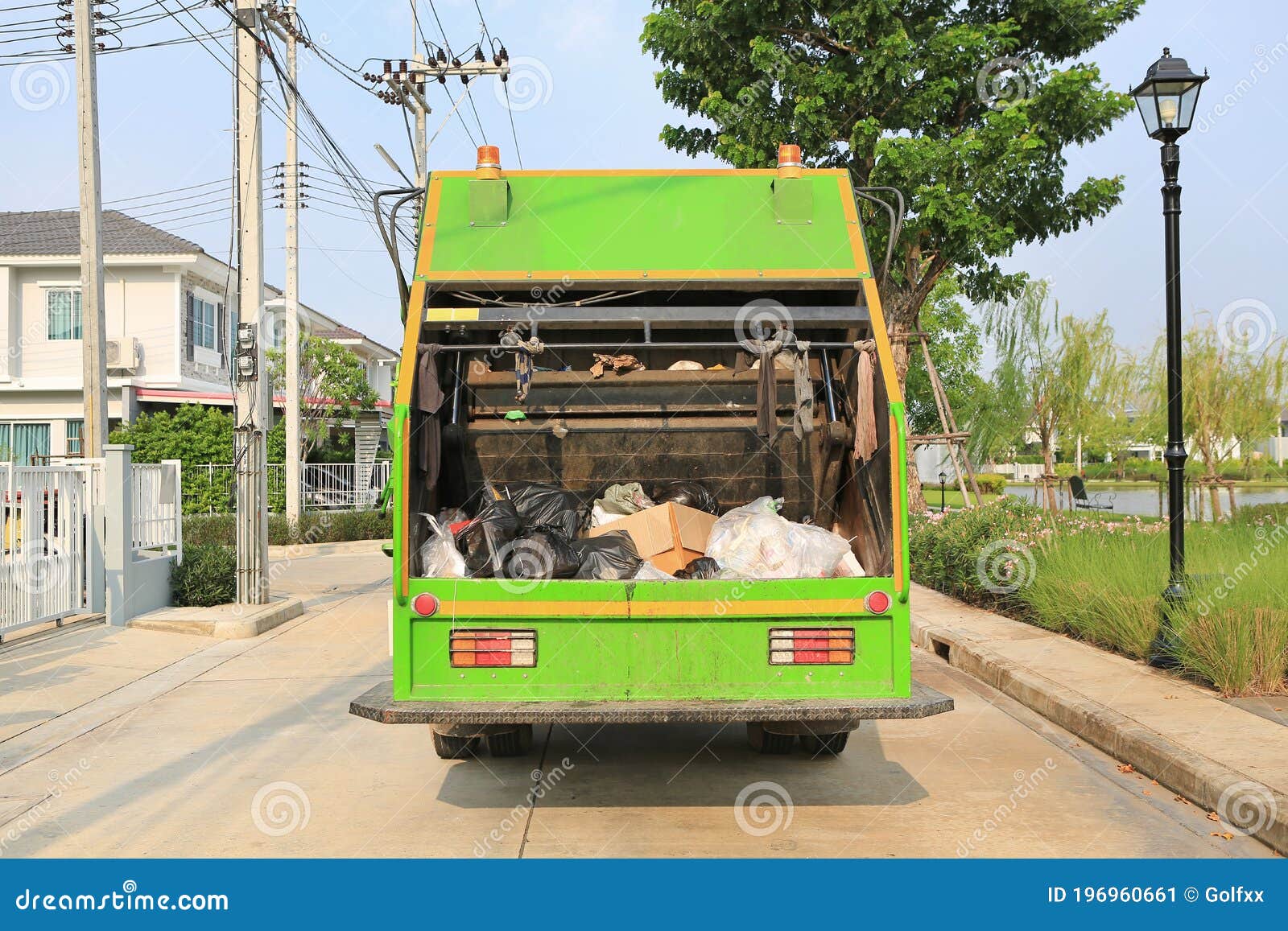 Garbage Truck with Loading Waste on the Road. Back View Stock Image ...
