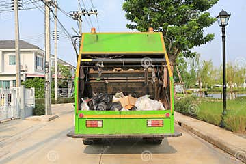 Garbage Truck with Loading Waste on the Road. Back View Stock Image ...