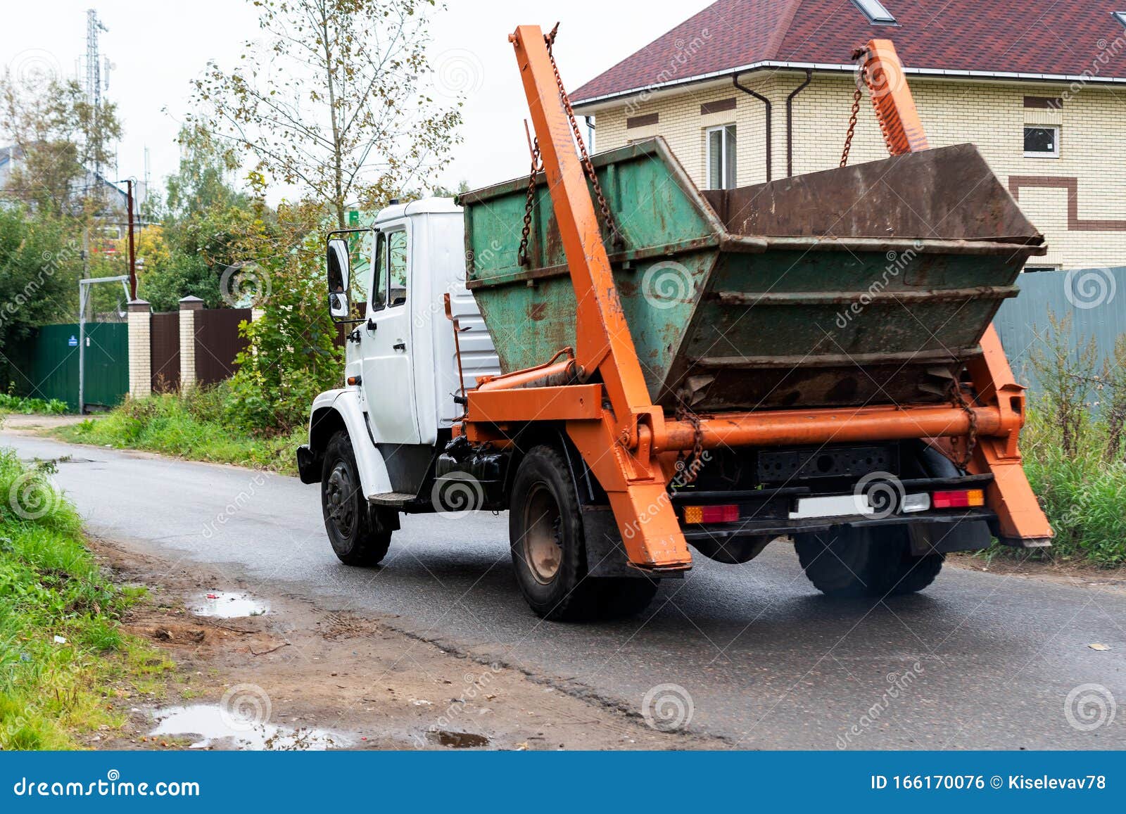 Garbage Truck Passes on a Country Road . Selective Focus Stock Photo ...